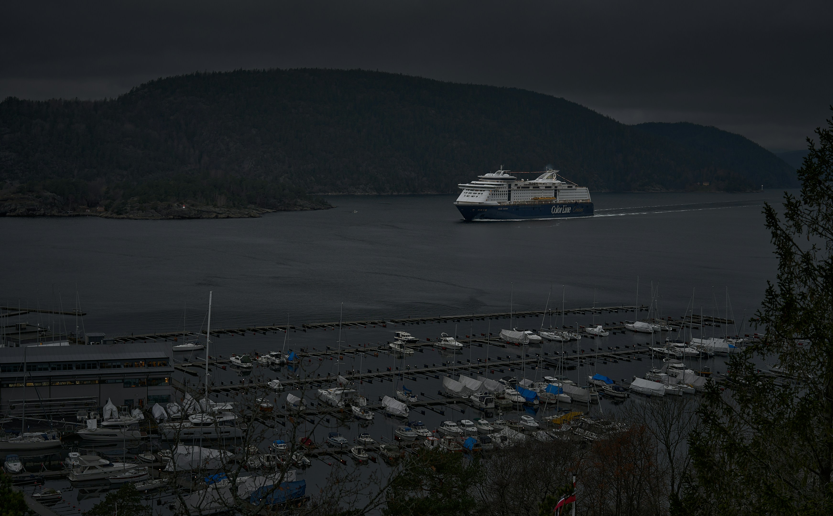 Dusk at the Cove: A Cruise Ship Looms Over a Quiet Marina