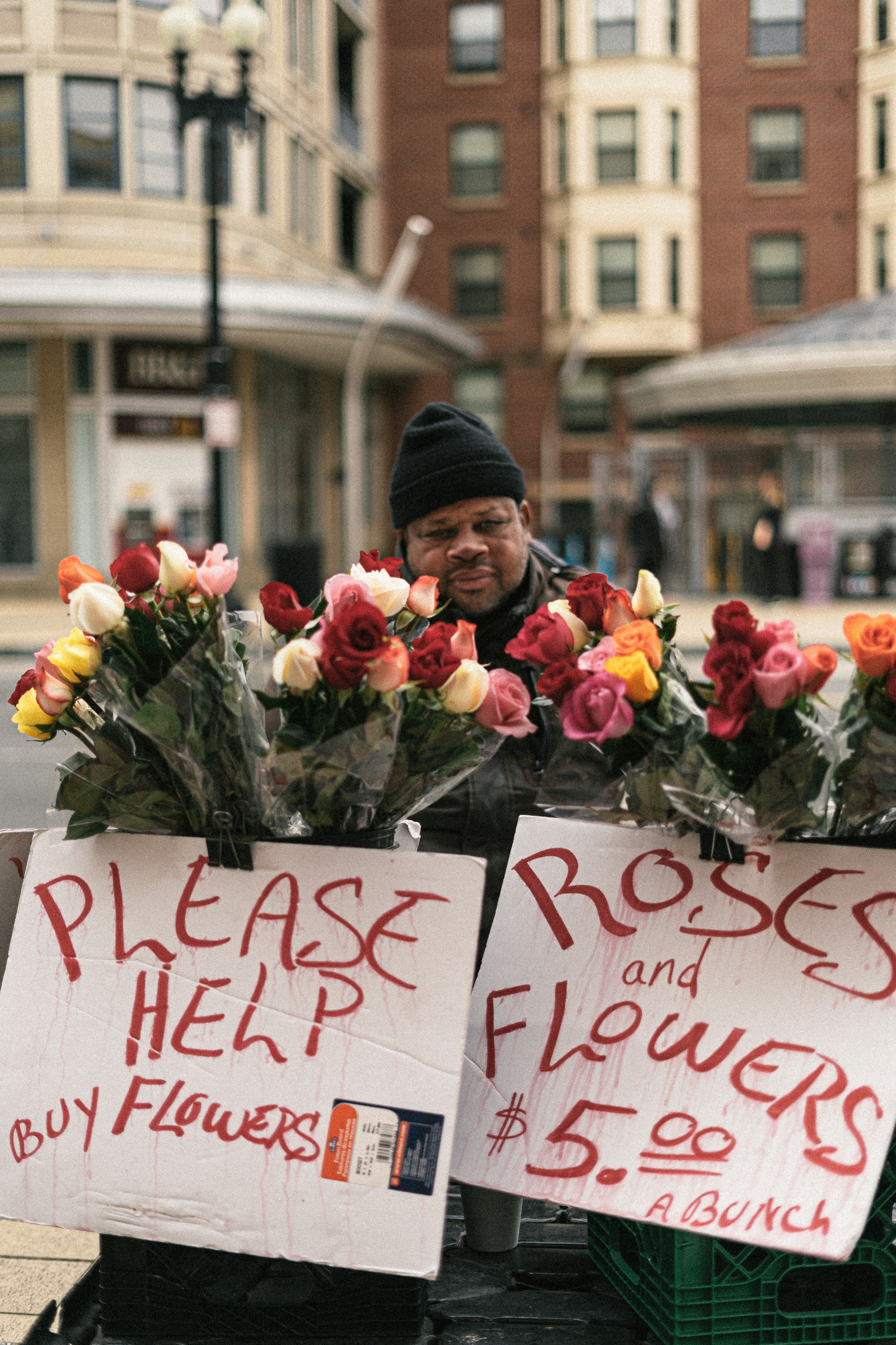 Flower Vendor Beneath Urban Facades