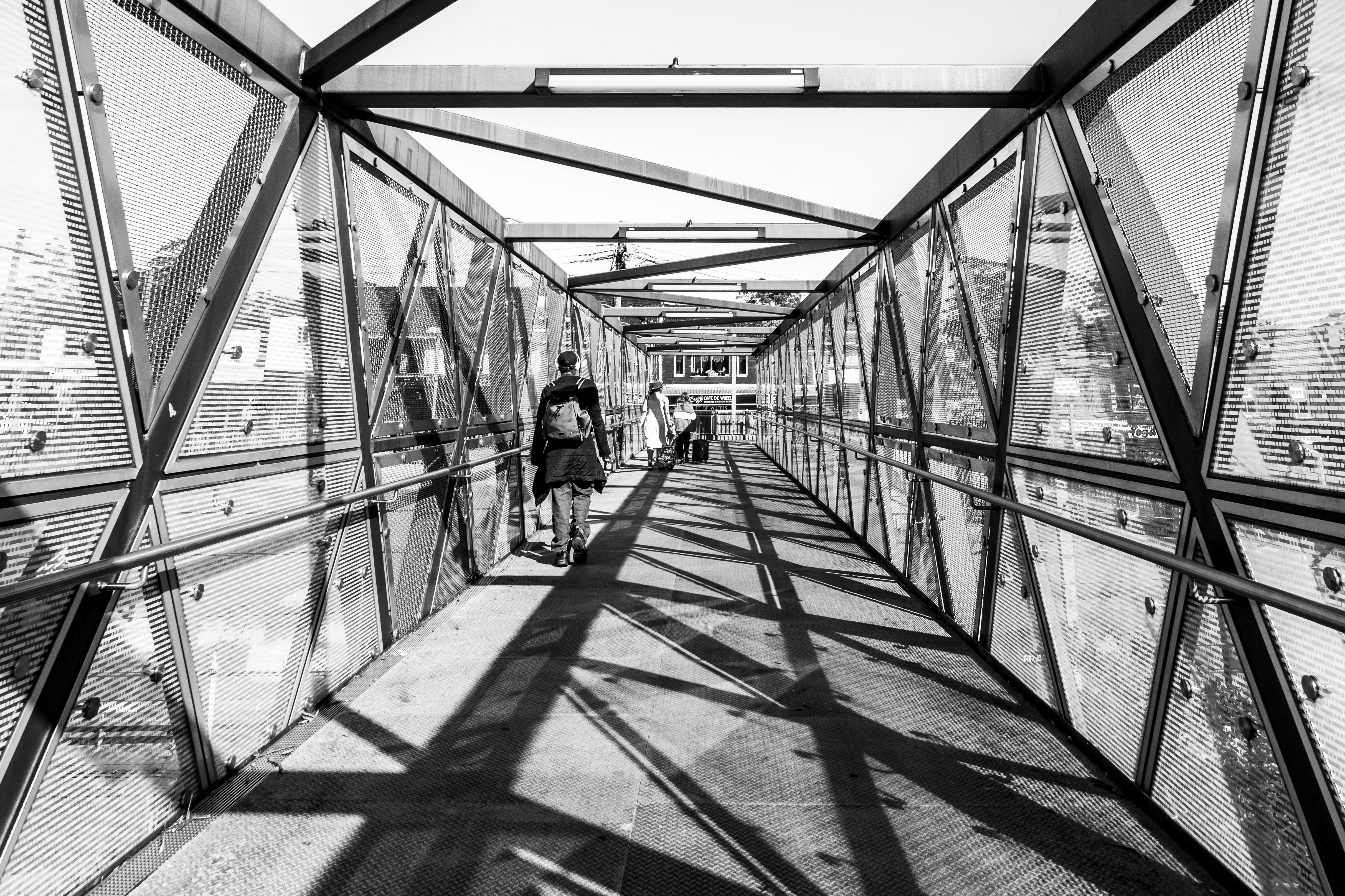 A person walking on a bridge photo – Free Bridges Image on Unsplash