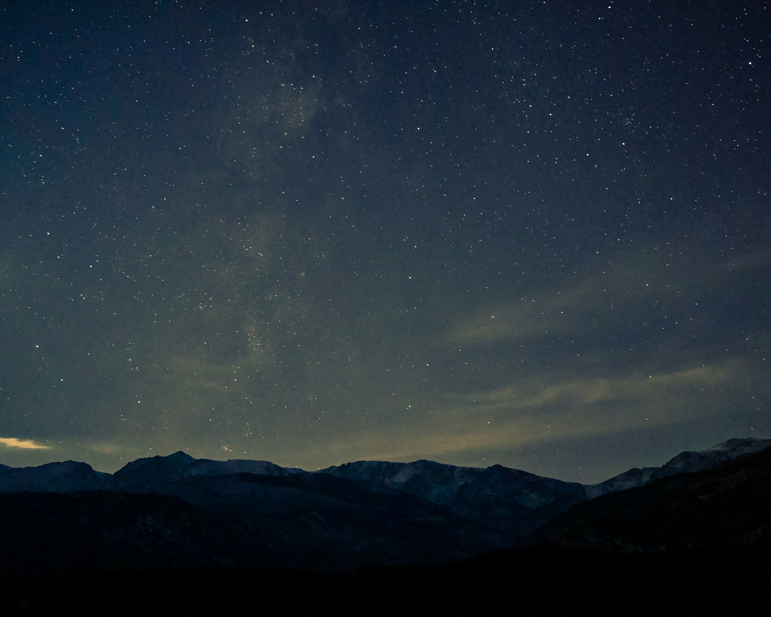 A starry night sky over mountains photo – Free Night Image on Unsplash