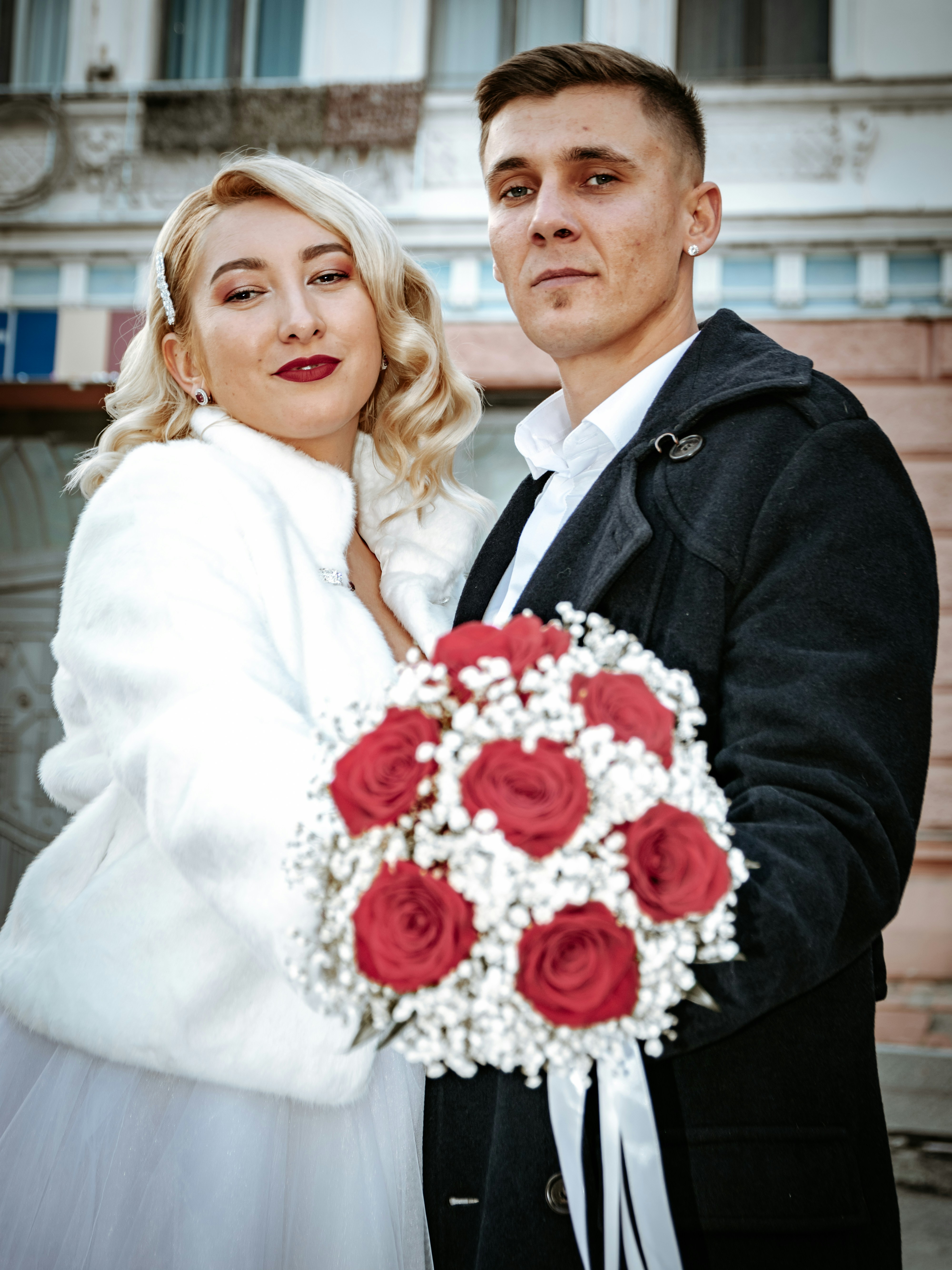 Crimson Roses, Urban Vows: A Bridal Moment in City Light