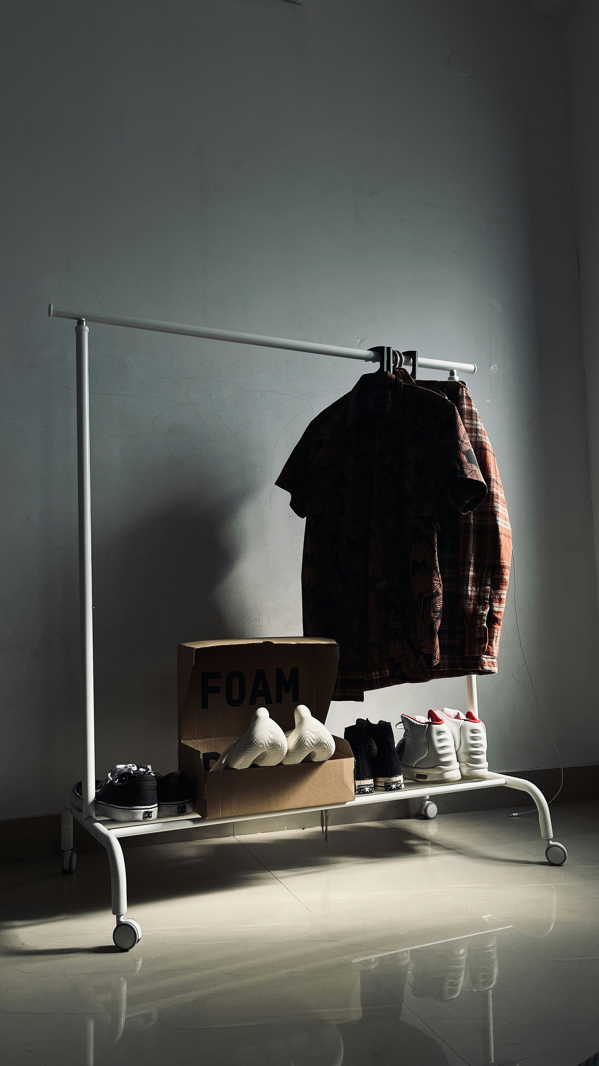 Wardrobe Stand: Velvet Coat and Sneakers on a Minimal Stage
