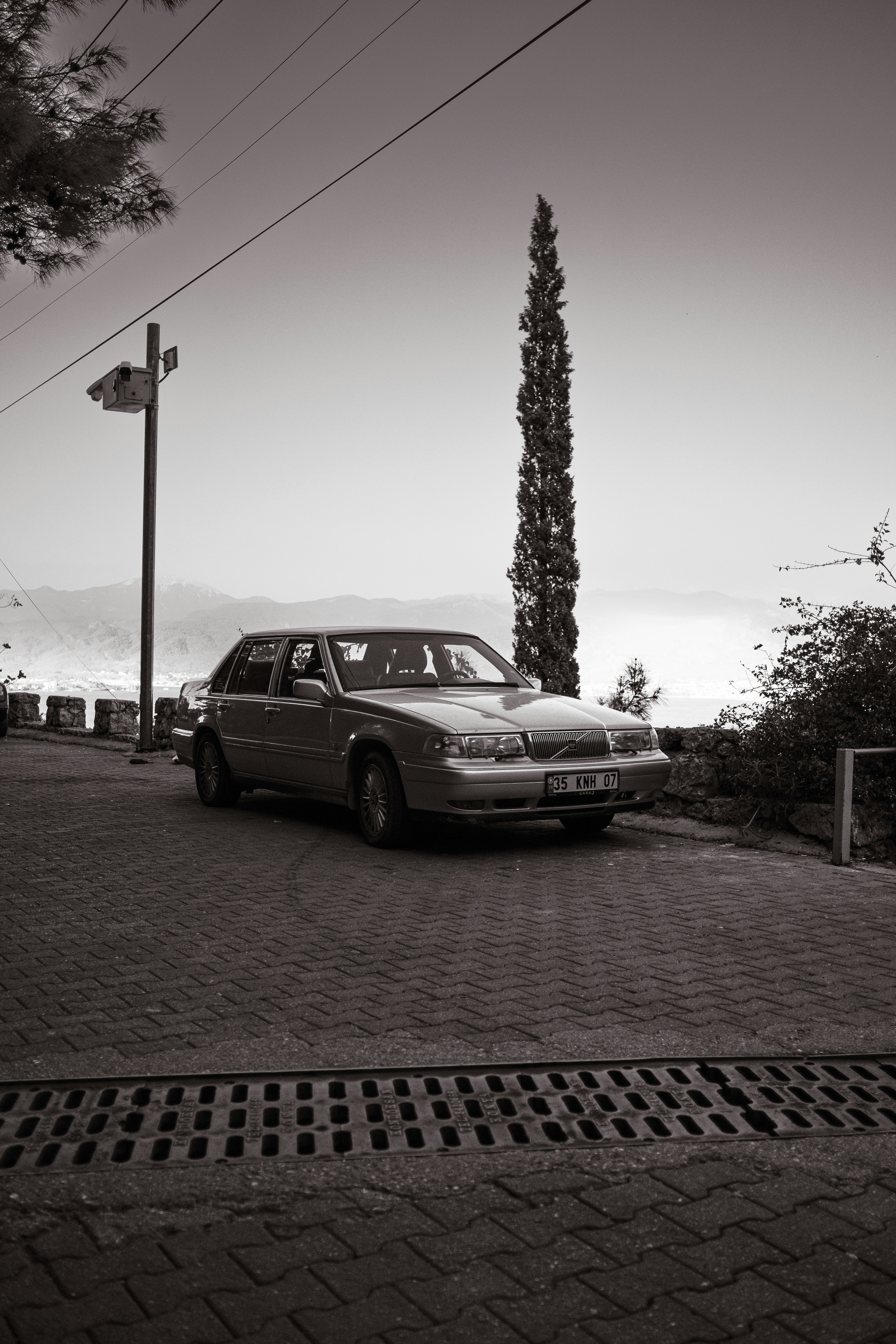 a car parked on a brick road