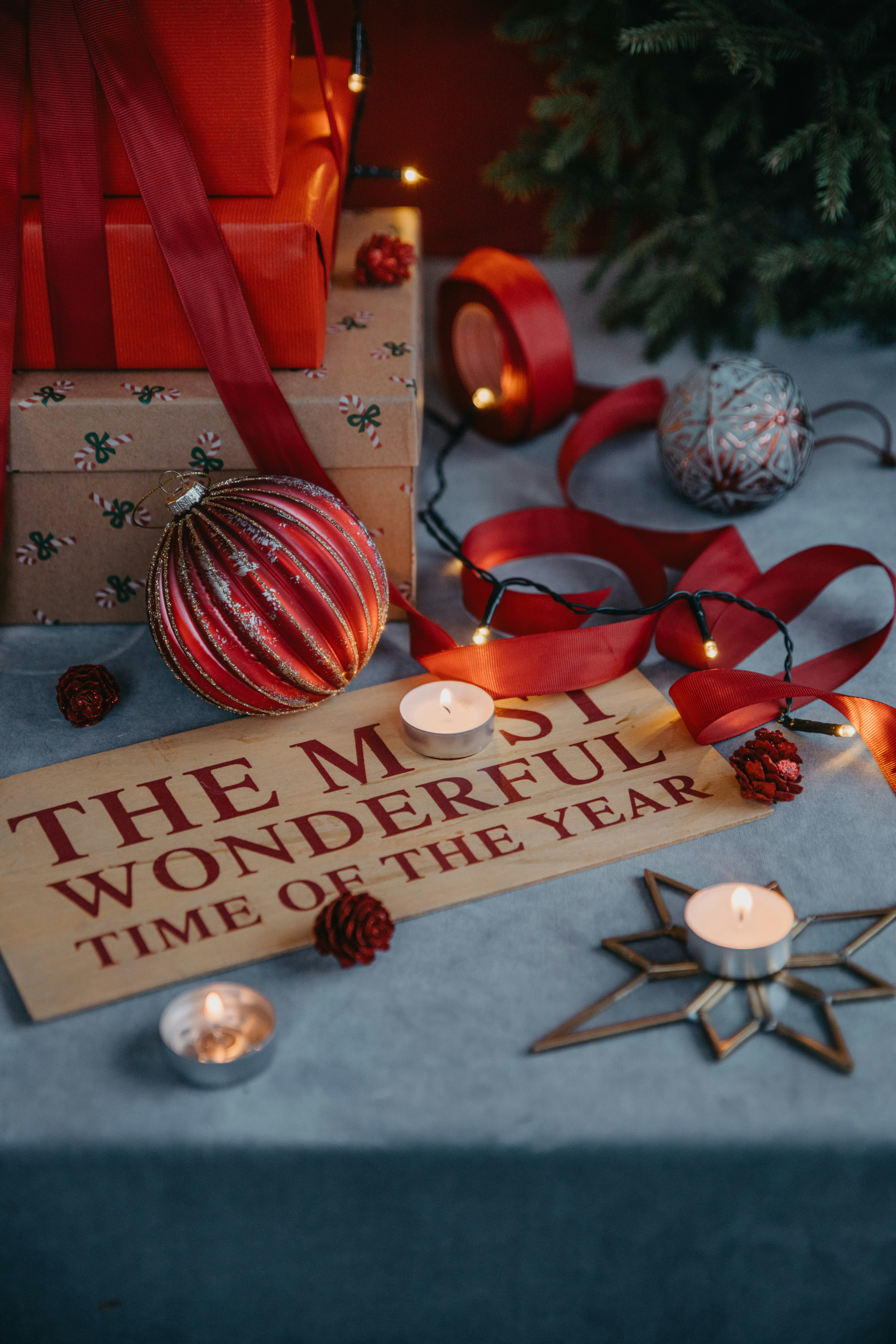 Red Ornament Among Gifts: A Warm Christmas Still Life