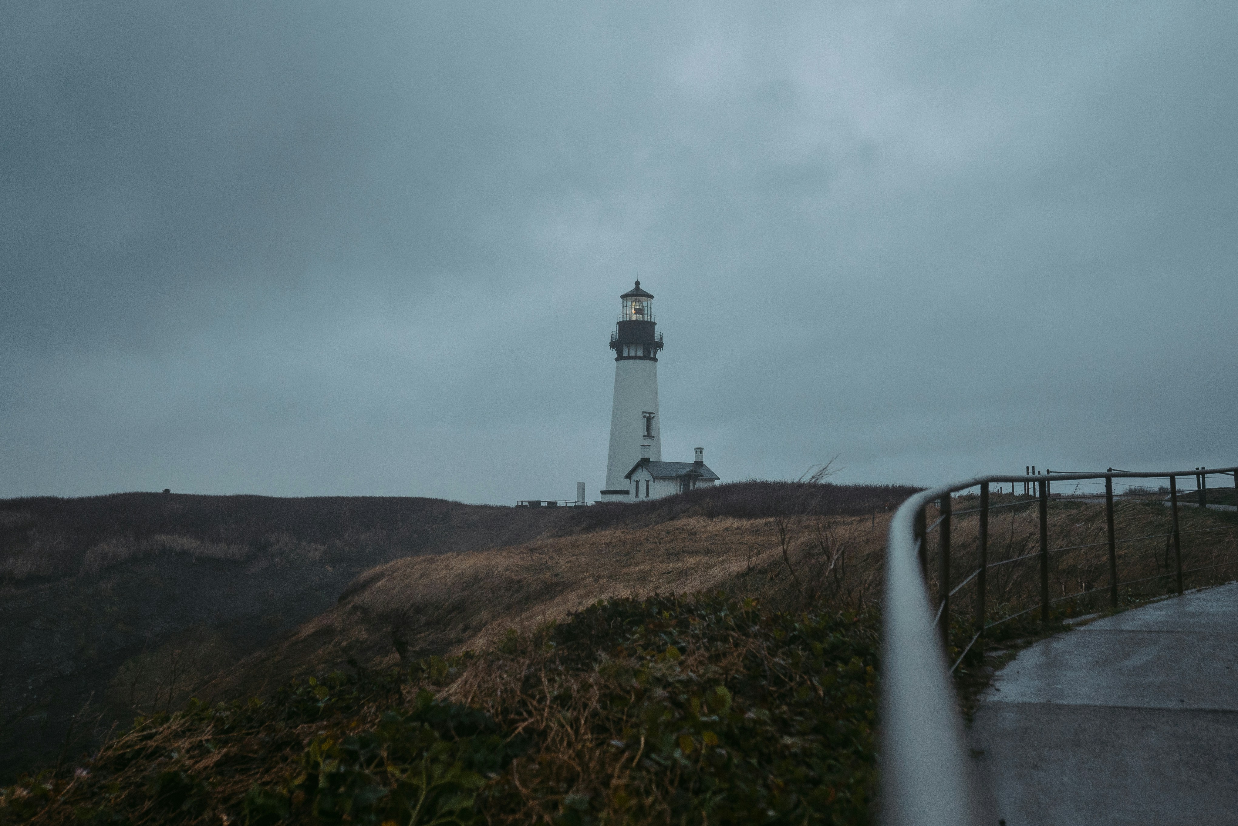 Fogbound Beacon on the Cliffside Path