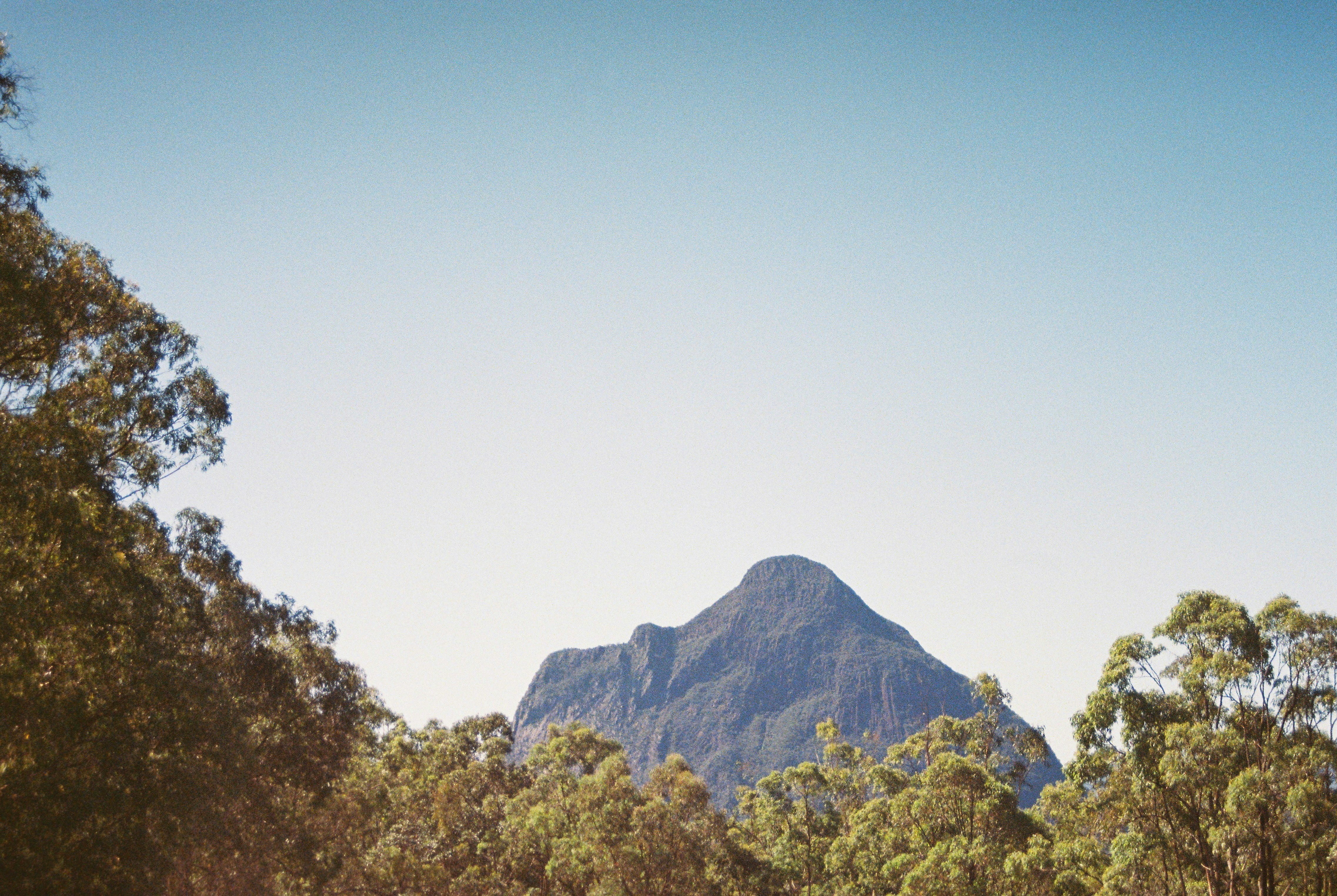 Verdant Ridge and the Lone Peak Under a Clear Sky