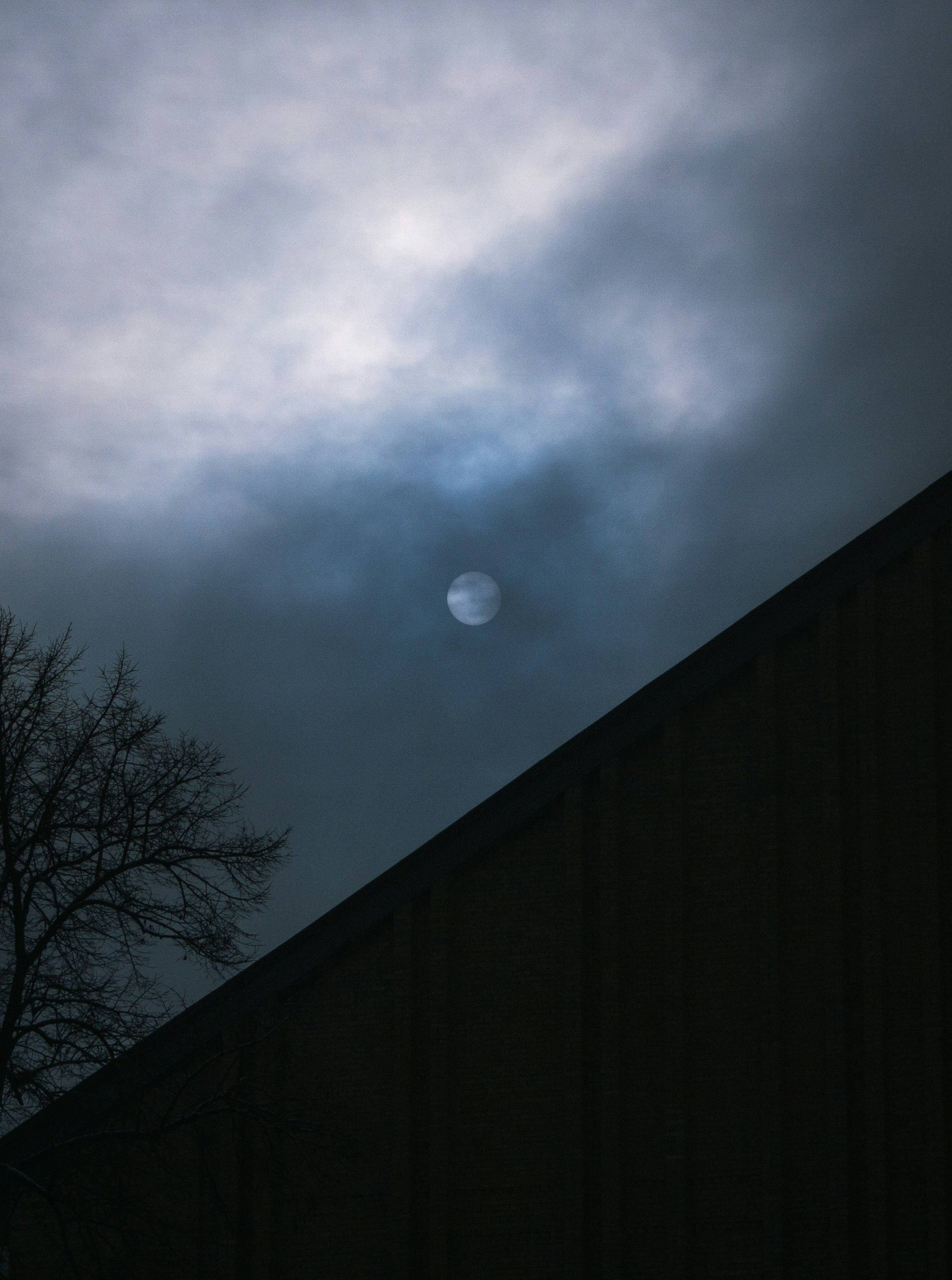 a building with a moon in the sky