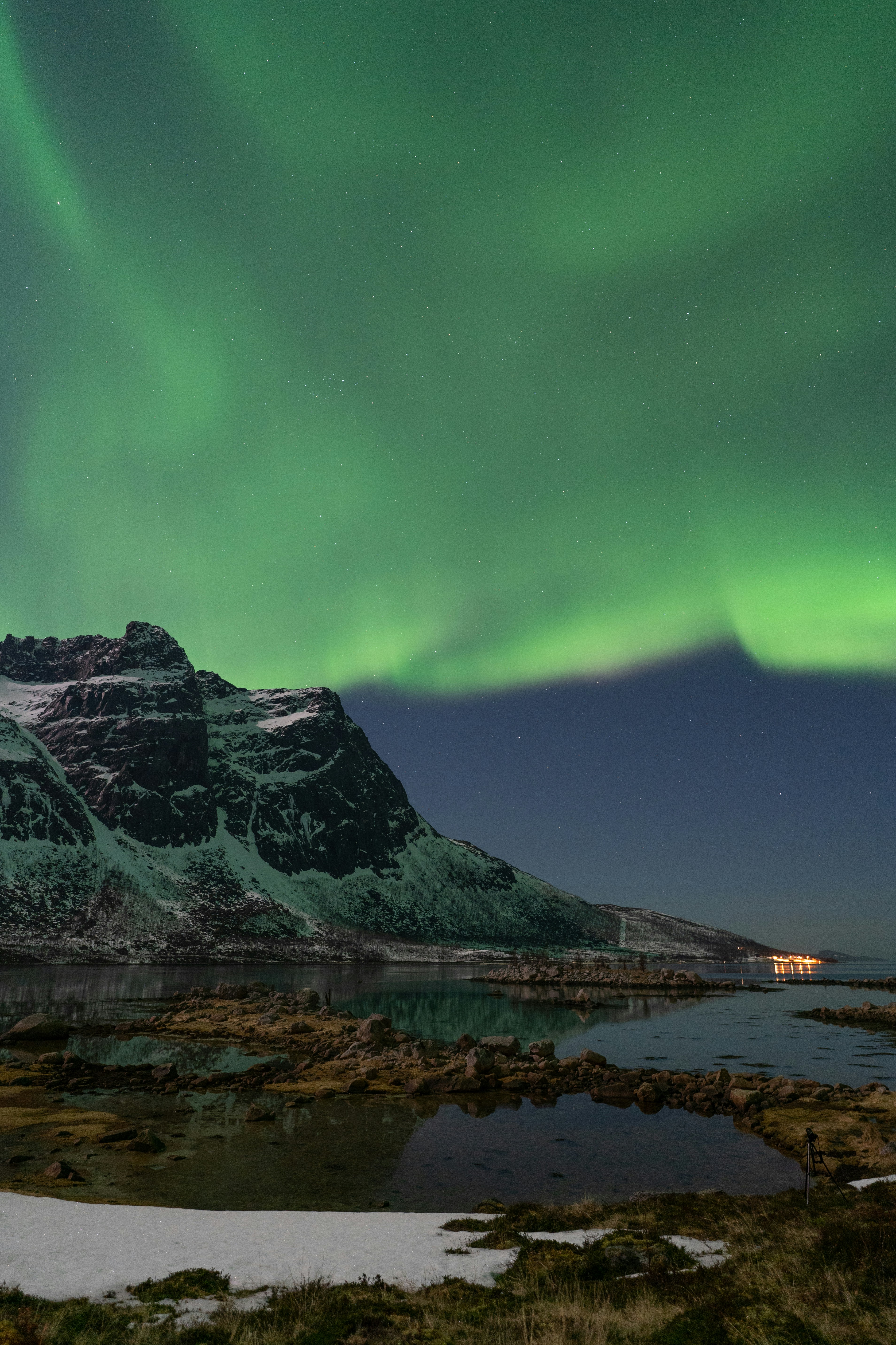 Whispers of the Northern Lights Over Majestic Peaks