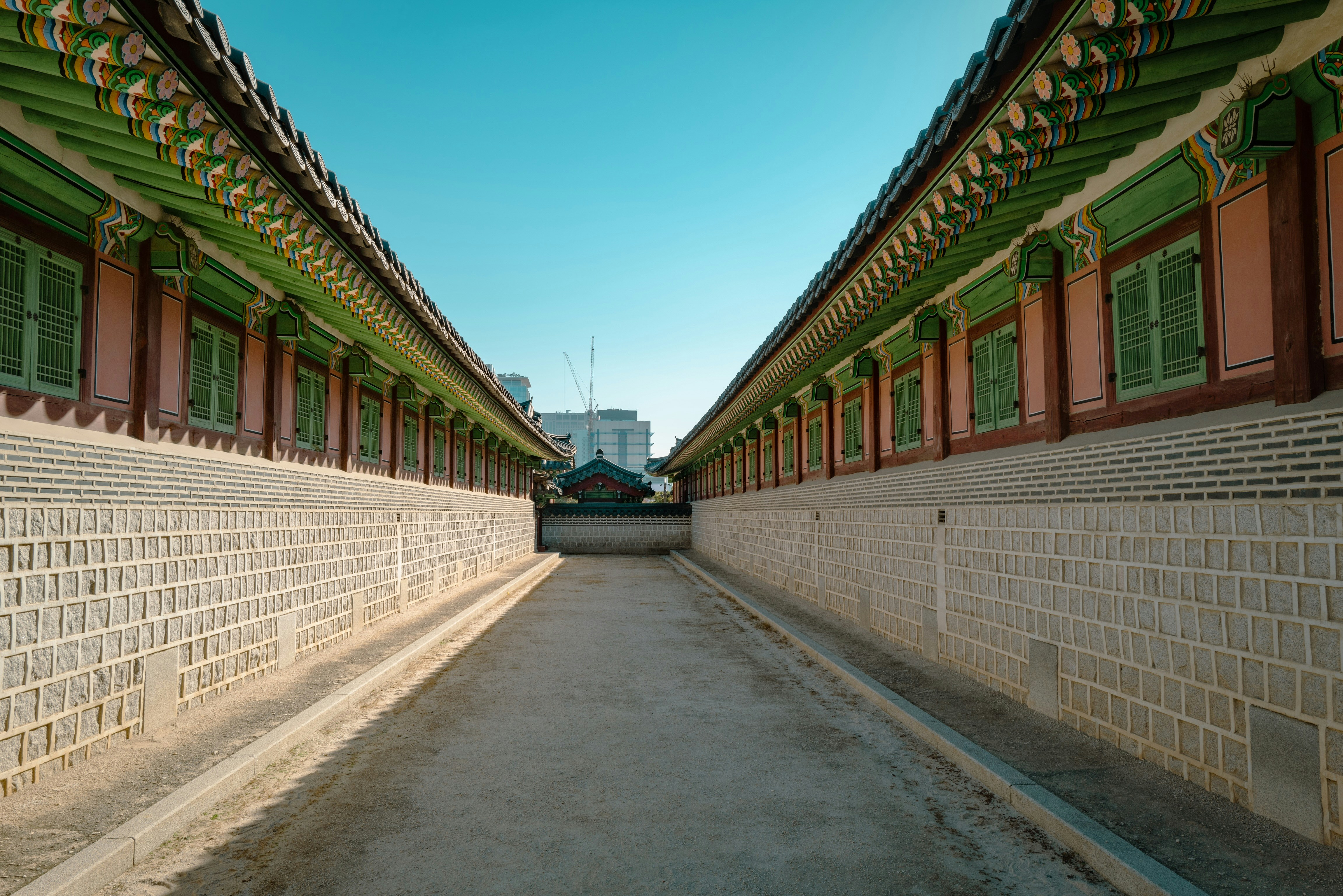 A road between two brick buildings photo – Free Street Image on Unsplash