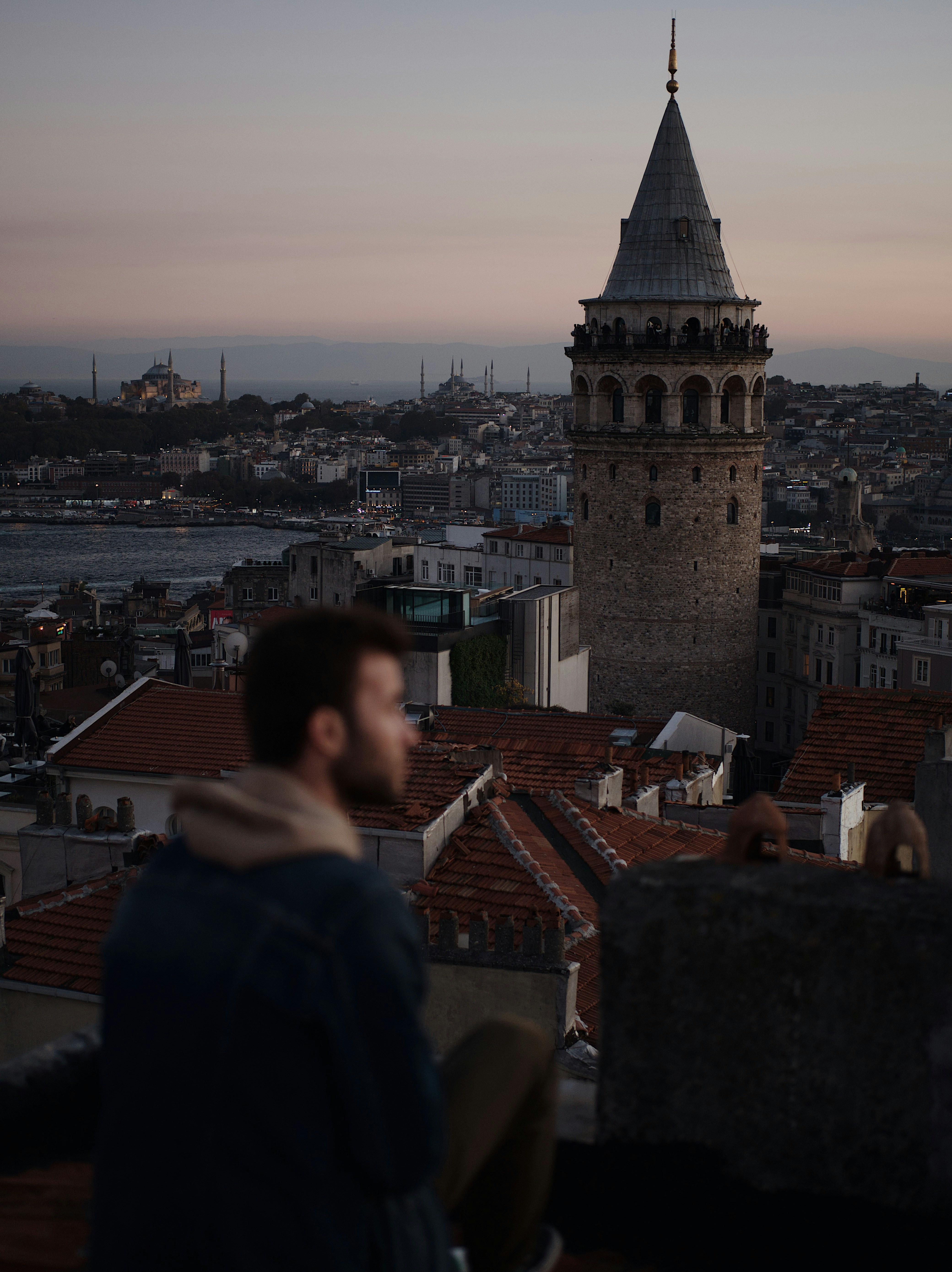 A person looking out over a city photo – Free Cityscape Image on Unsplash