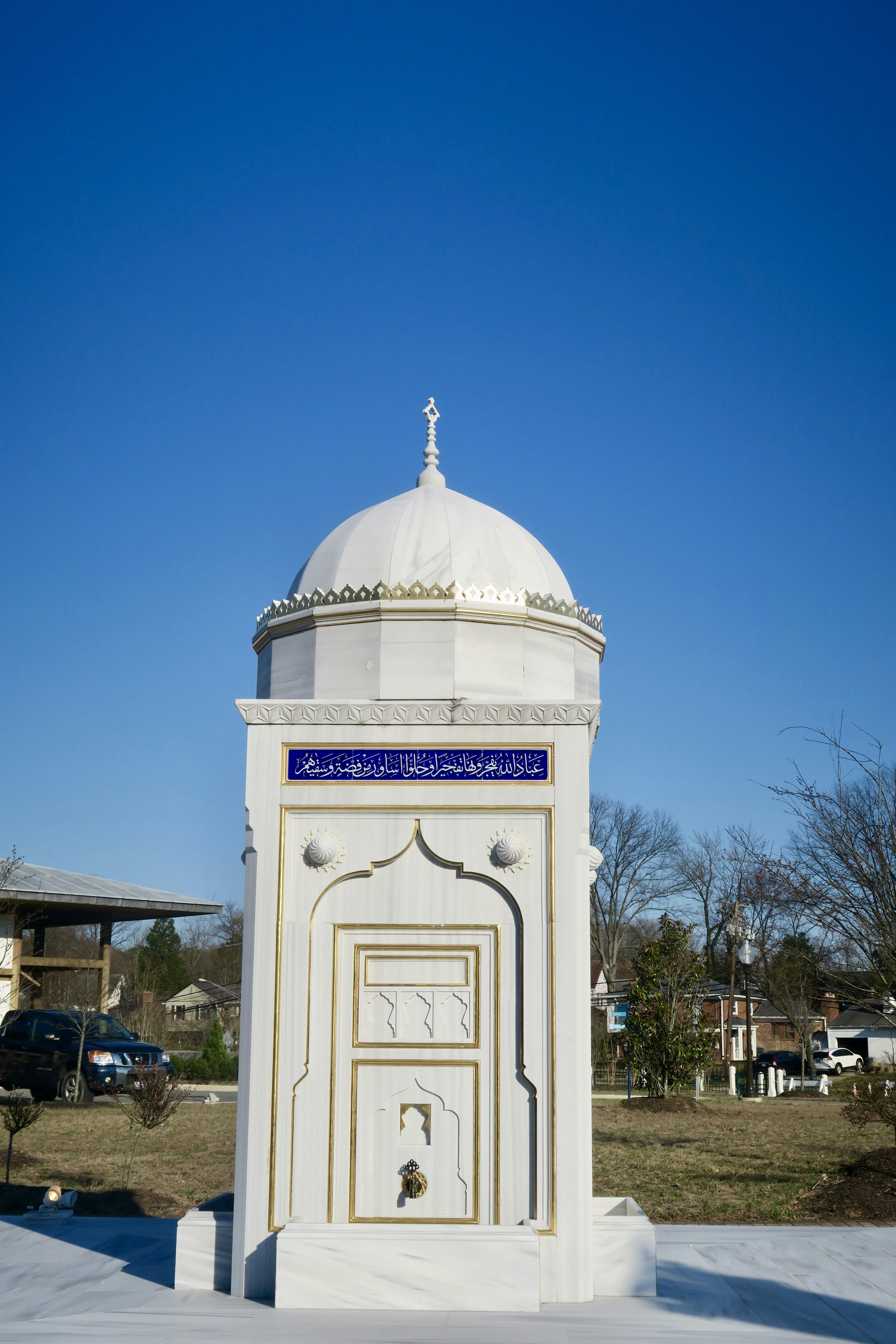 Ivory Dome Shrine Rising in a Quiet Park Under a Clear Azure Sky
