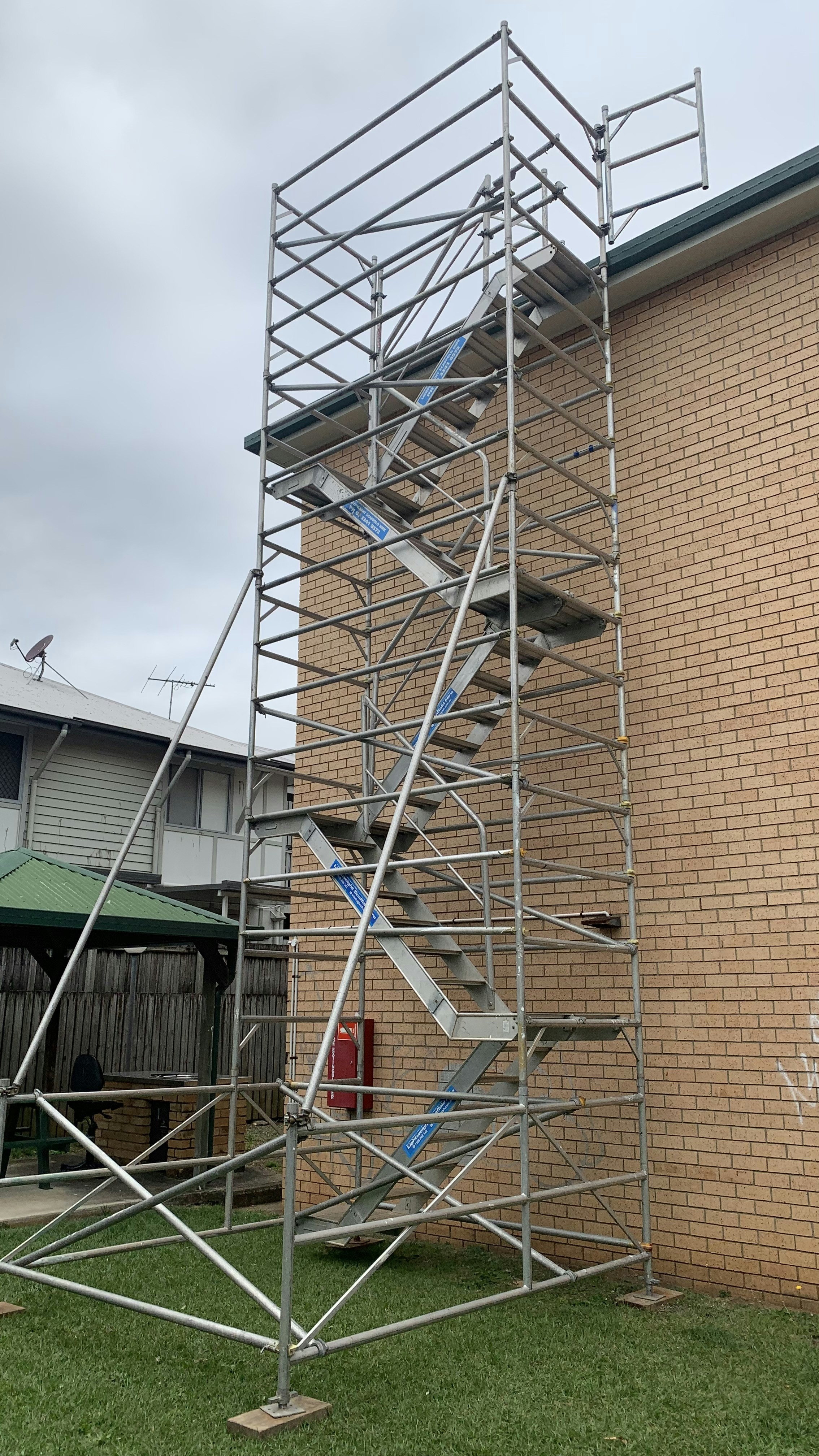 A ladder next to a brick building photo – Free Image on Unsplash