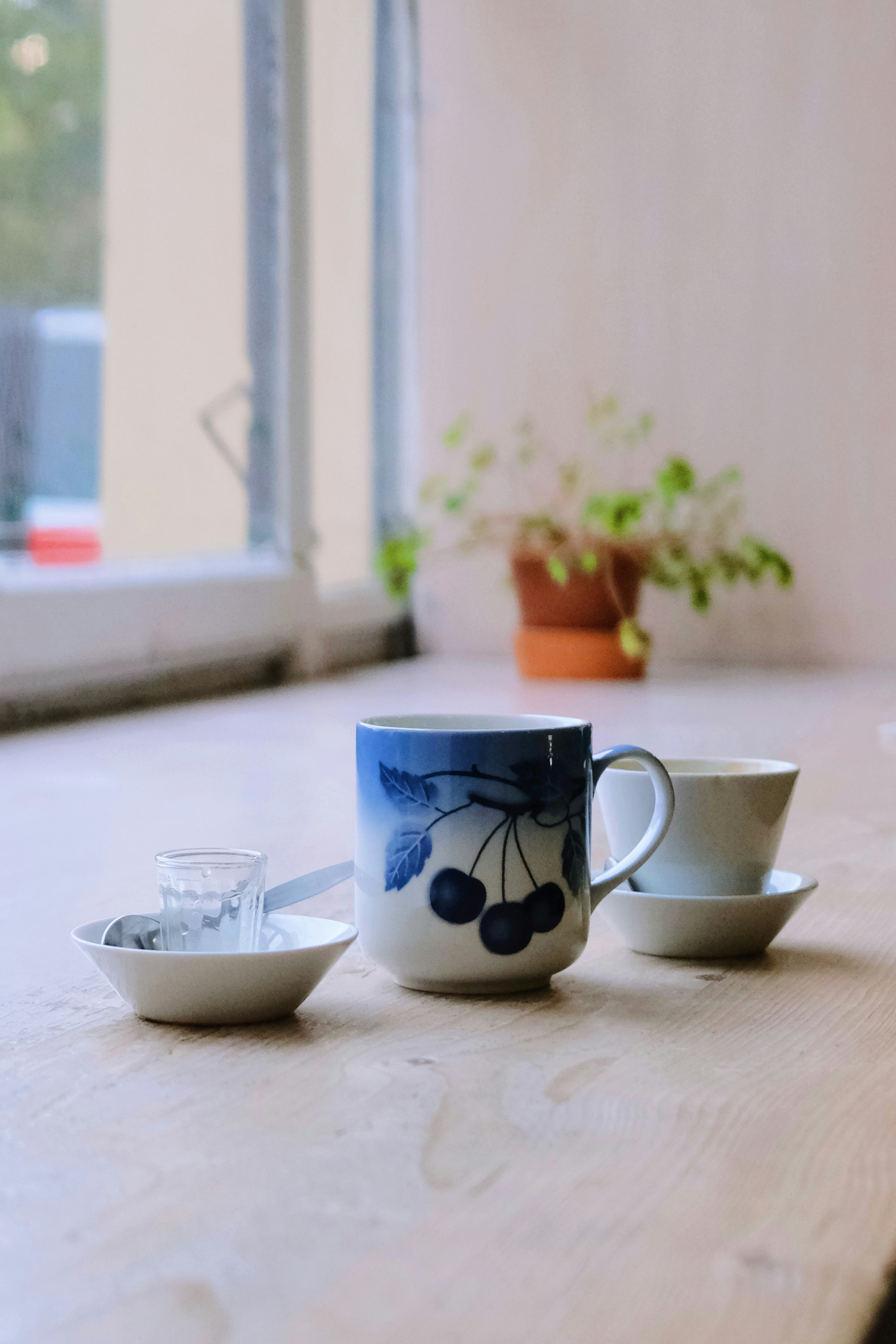 a tea set and a cup on a table