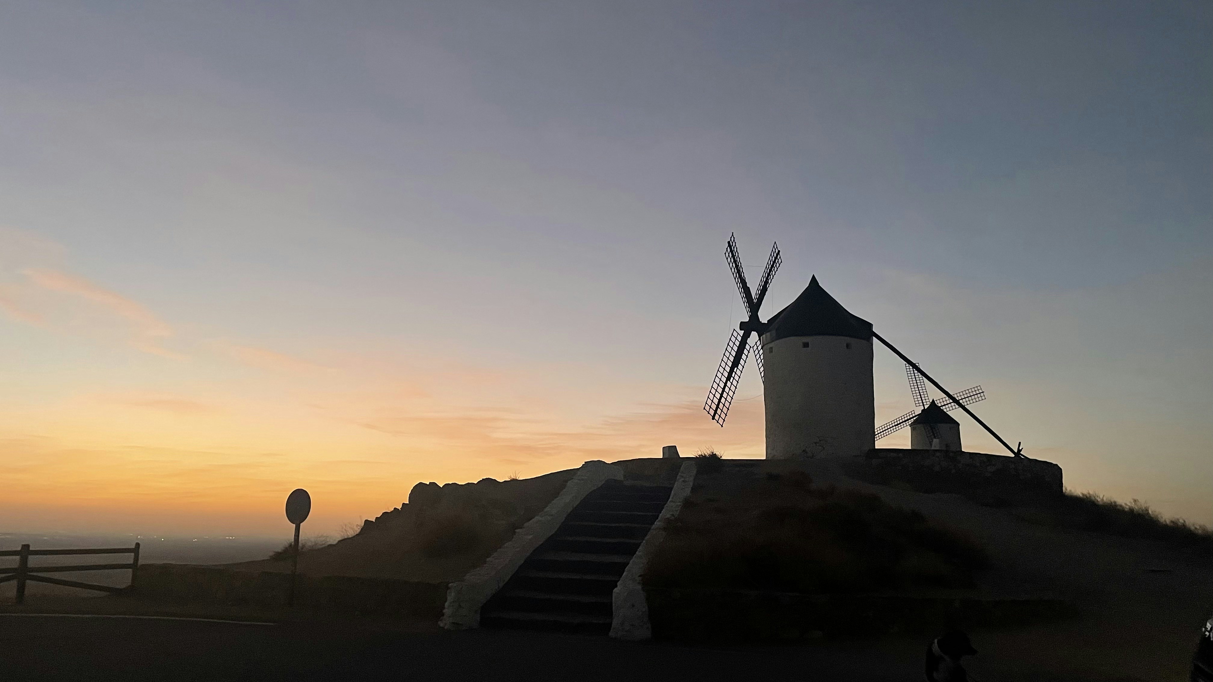 A windmill on a hill photo – Free Consuegra Image on Unsplash