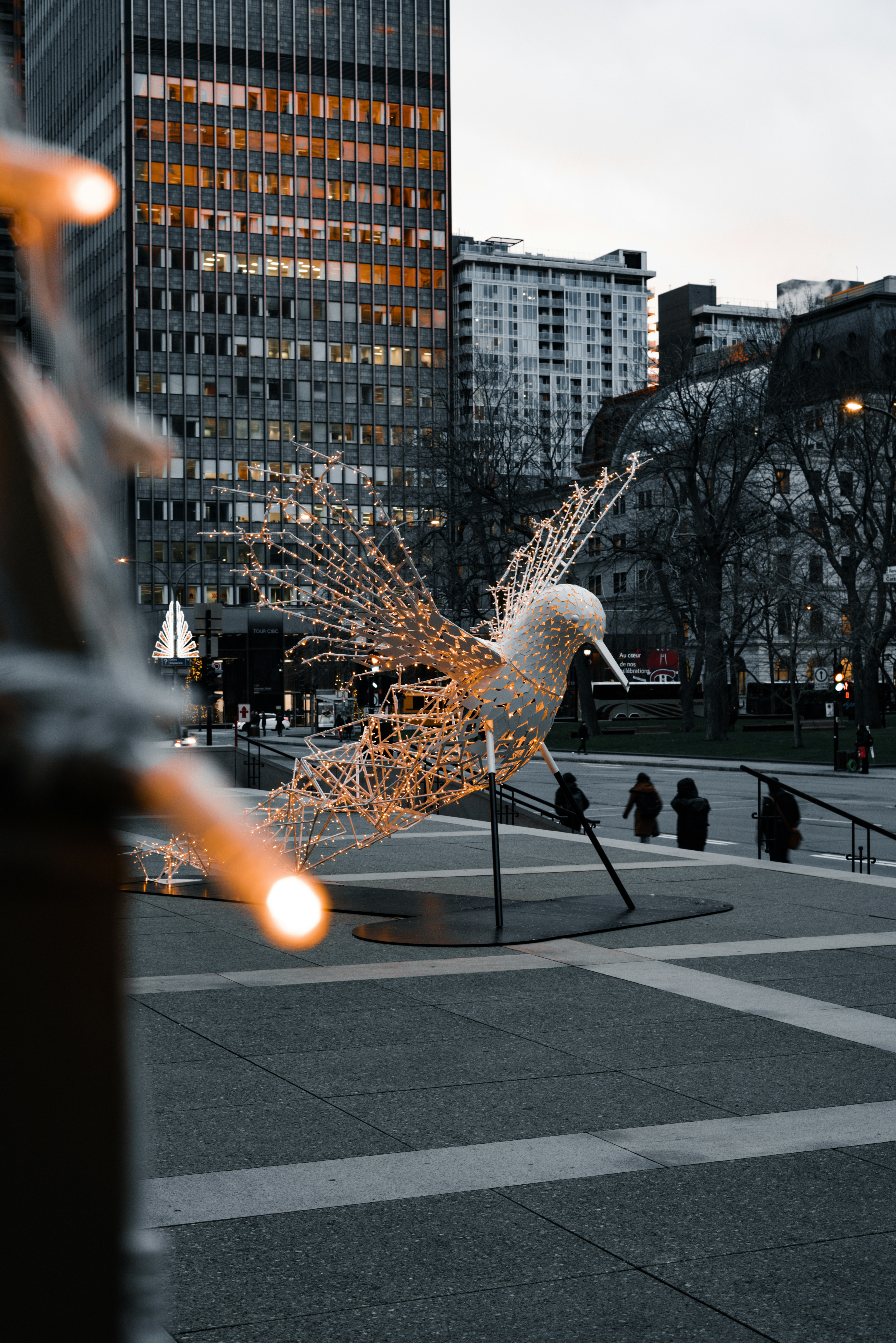 City Swan of Light: A Wireframe Monument in Evening Square