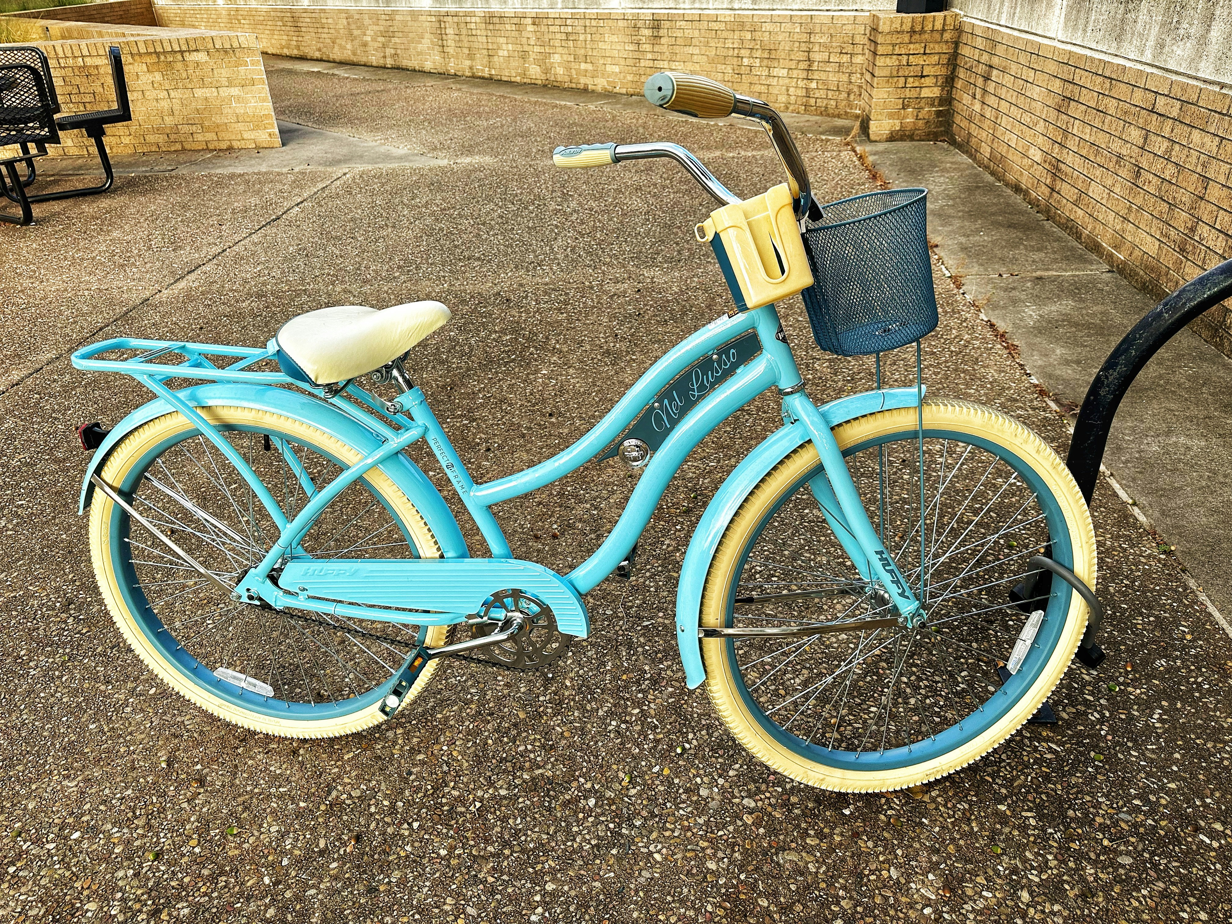 Pastel Blue Cruiser by a Brick Terrace