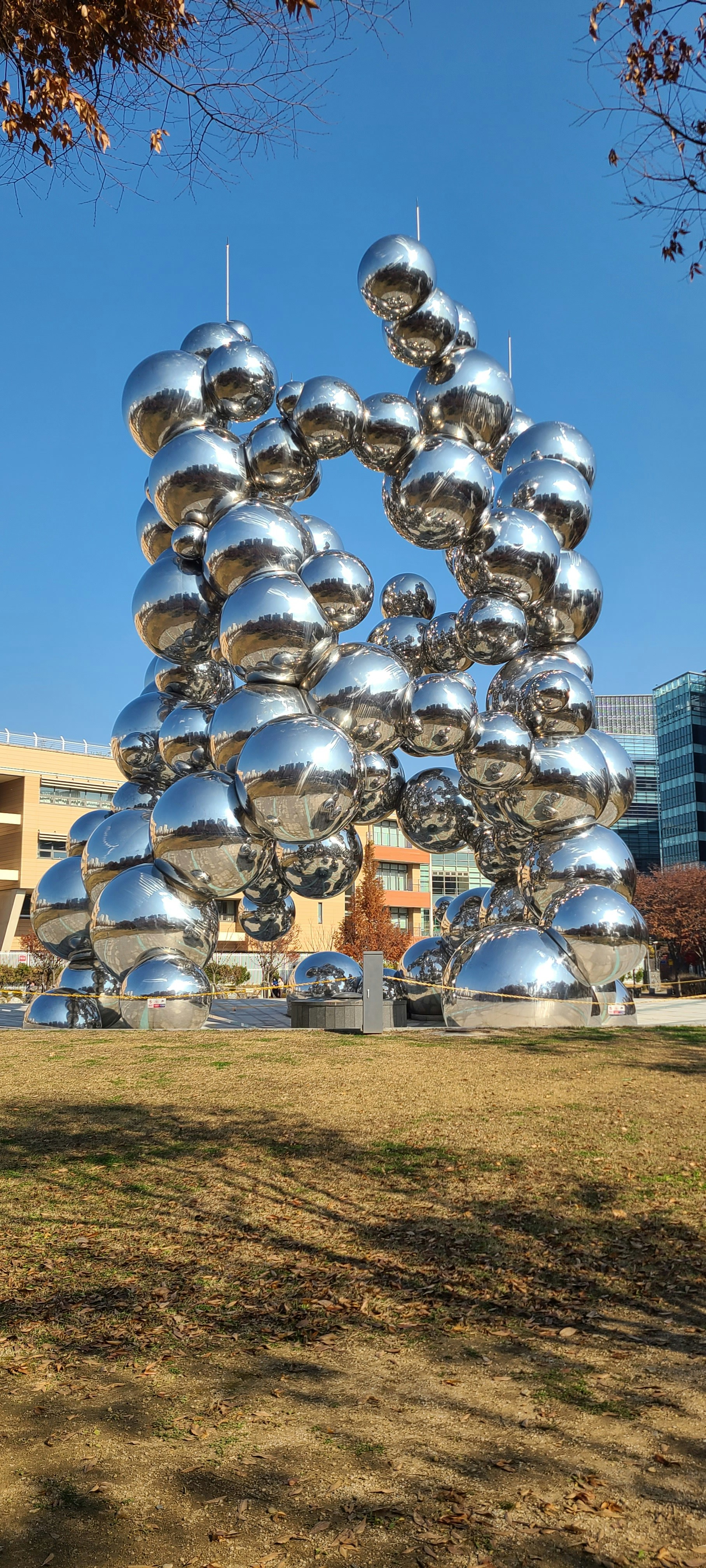 A structure with many metal balls on it photo – Free Landmark Image on ...