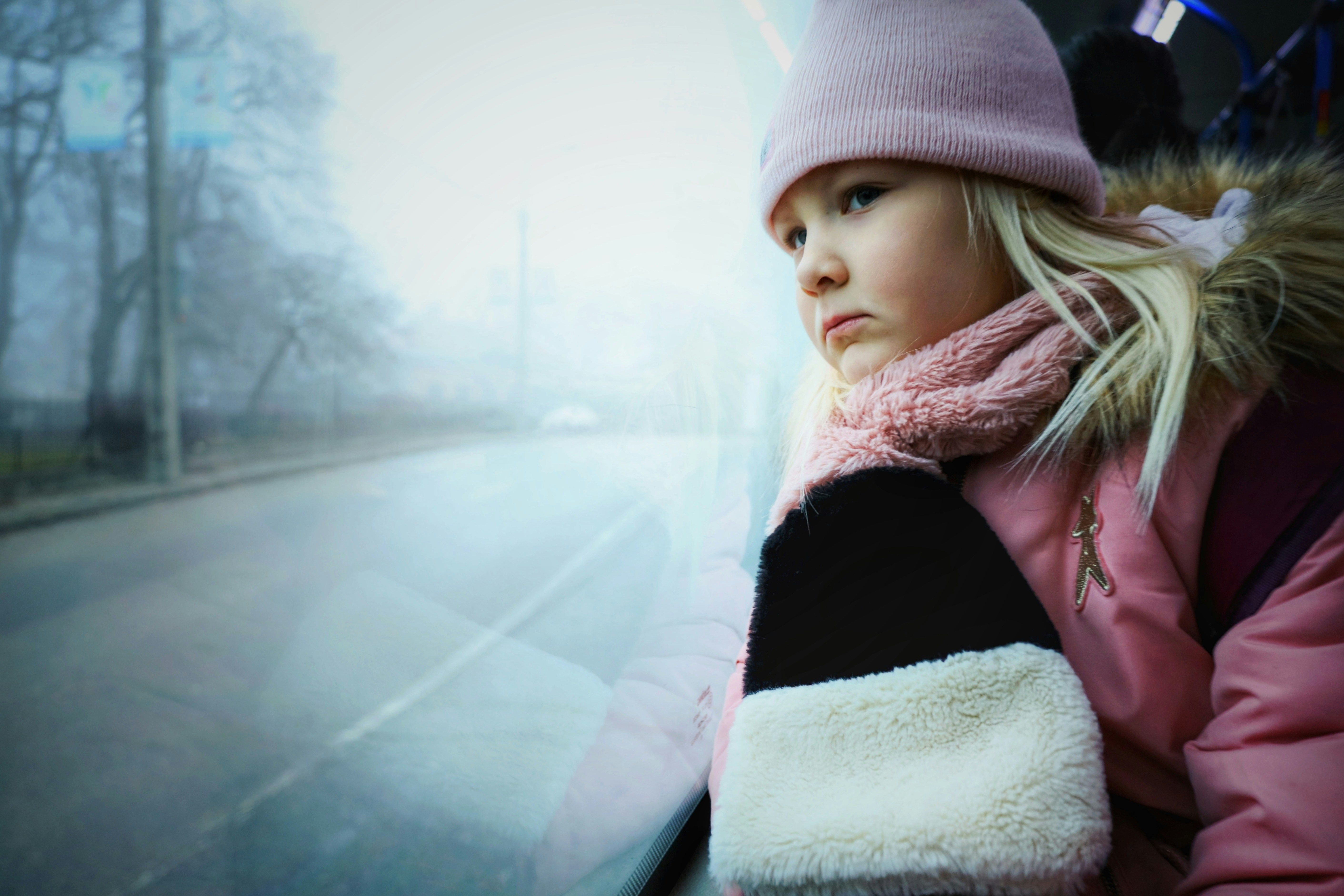 Through Frosted Glass: A Winter Bus Window Portrait