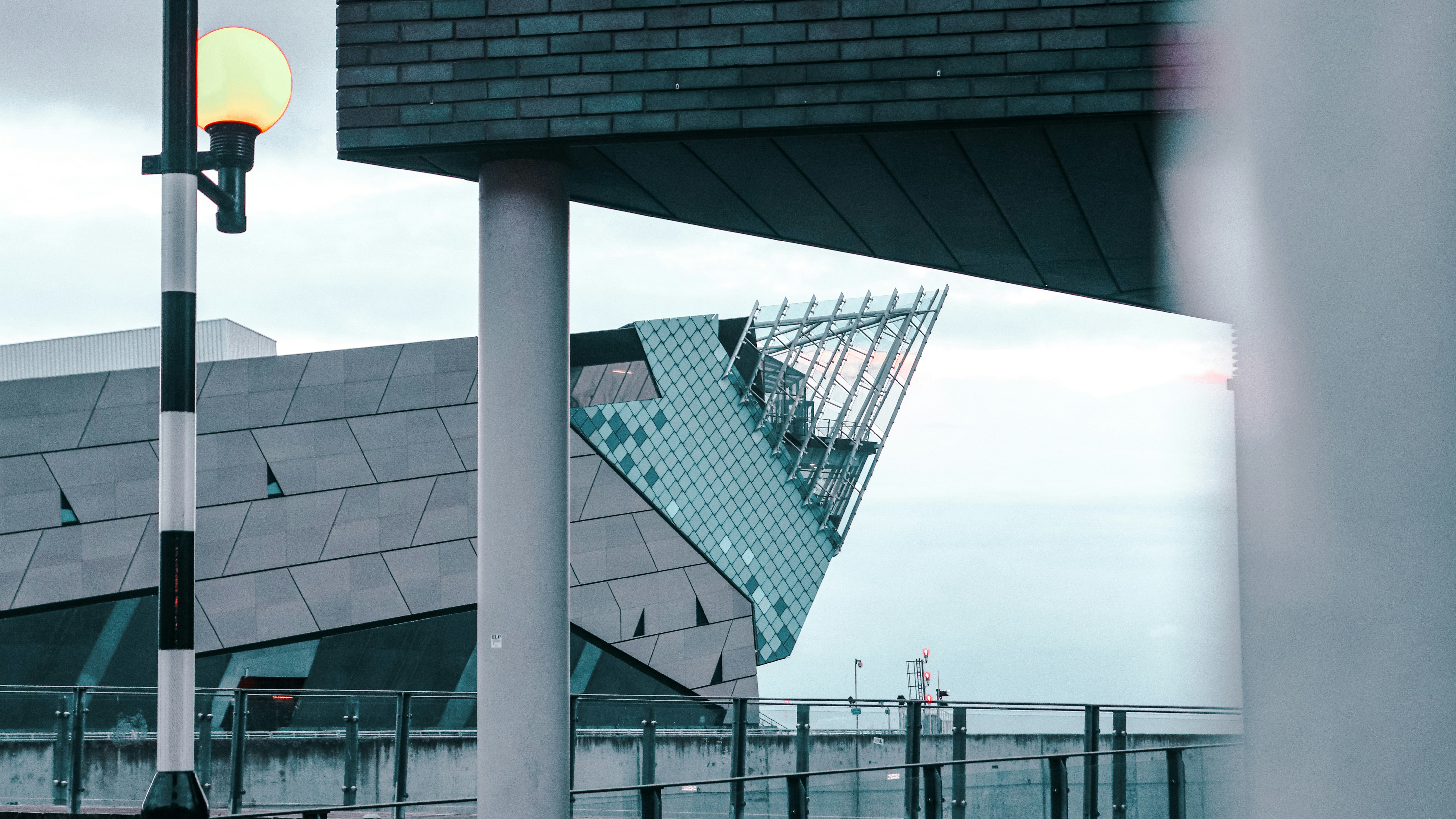 Triangular Glass Prism Framing a Cityscape