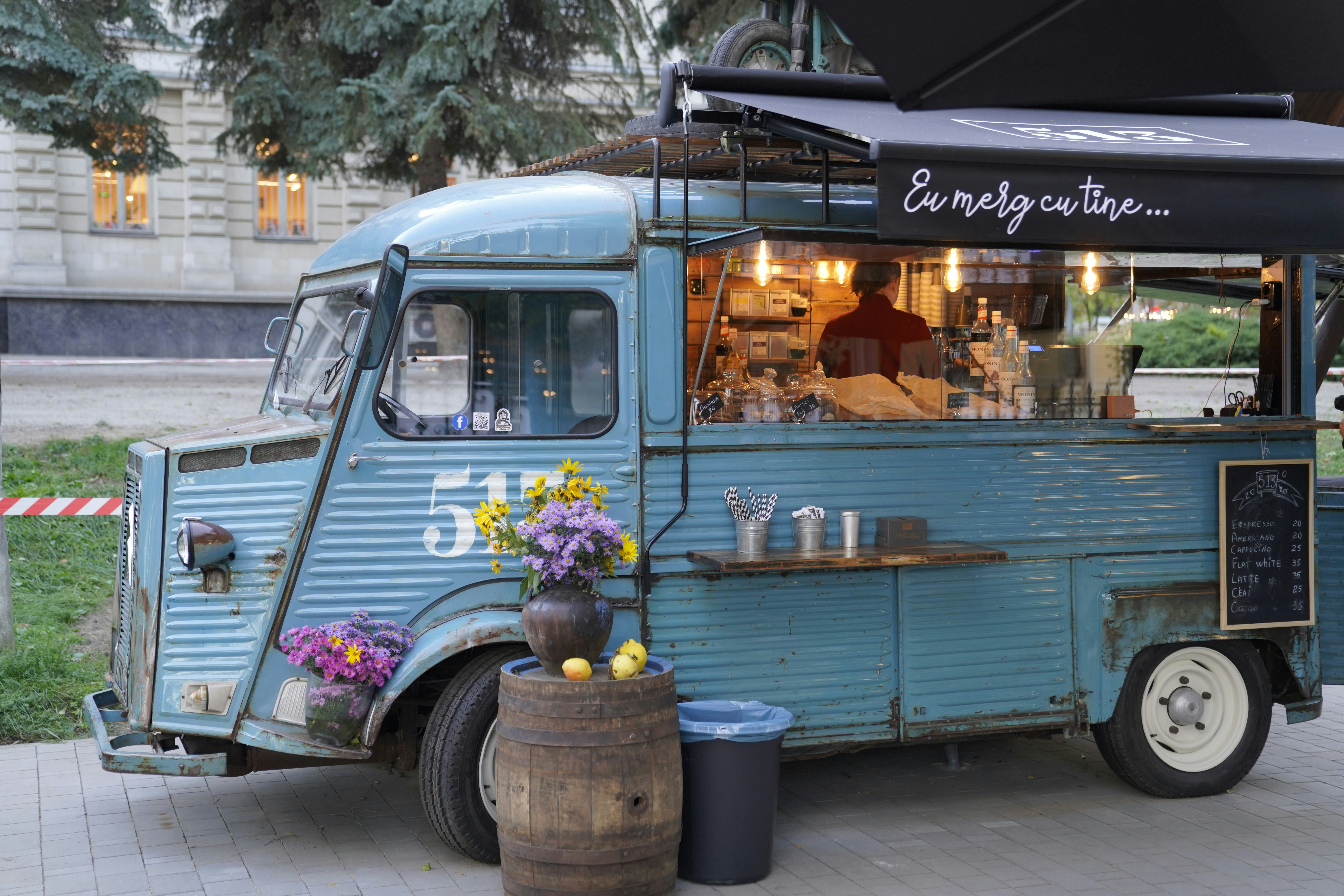 a small blue and white food truck