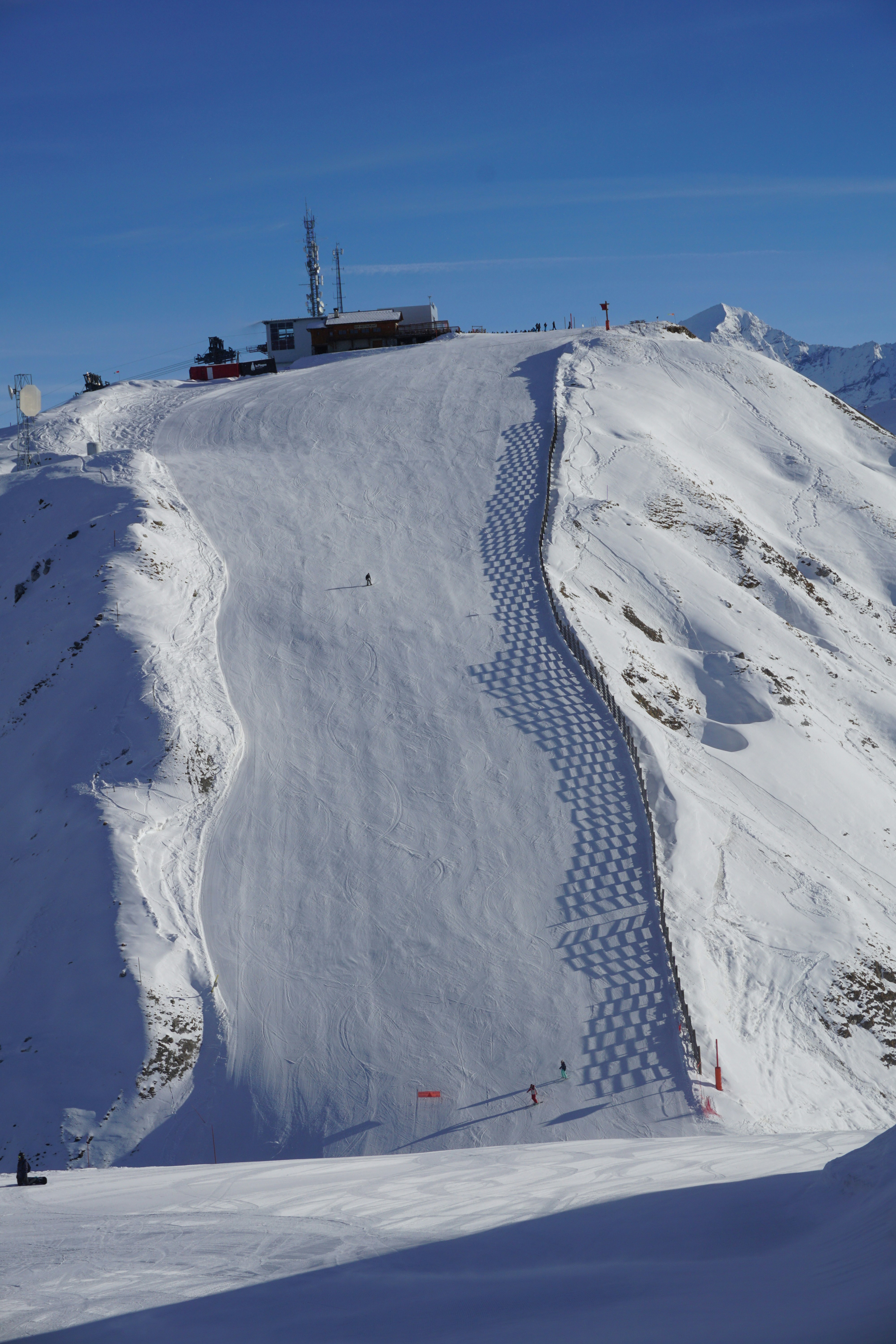 High-Altitude Snow Trail to a Cliffside Roof