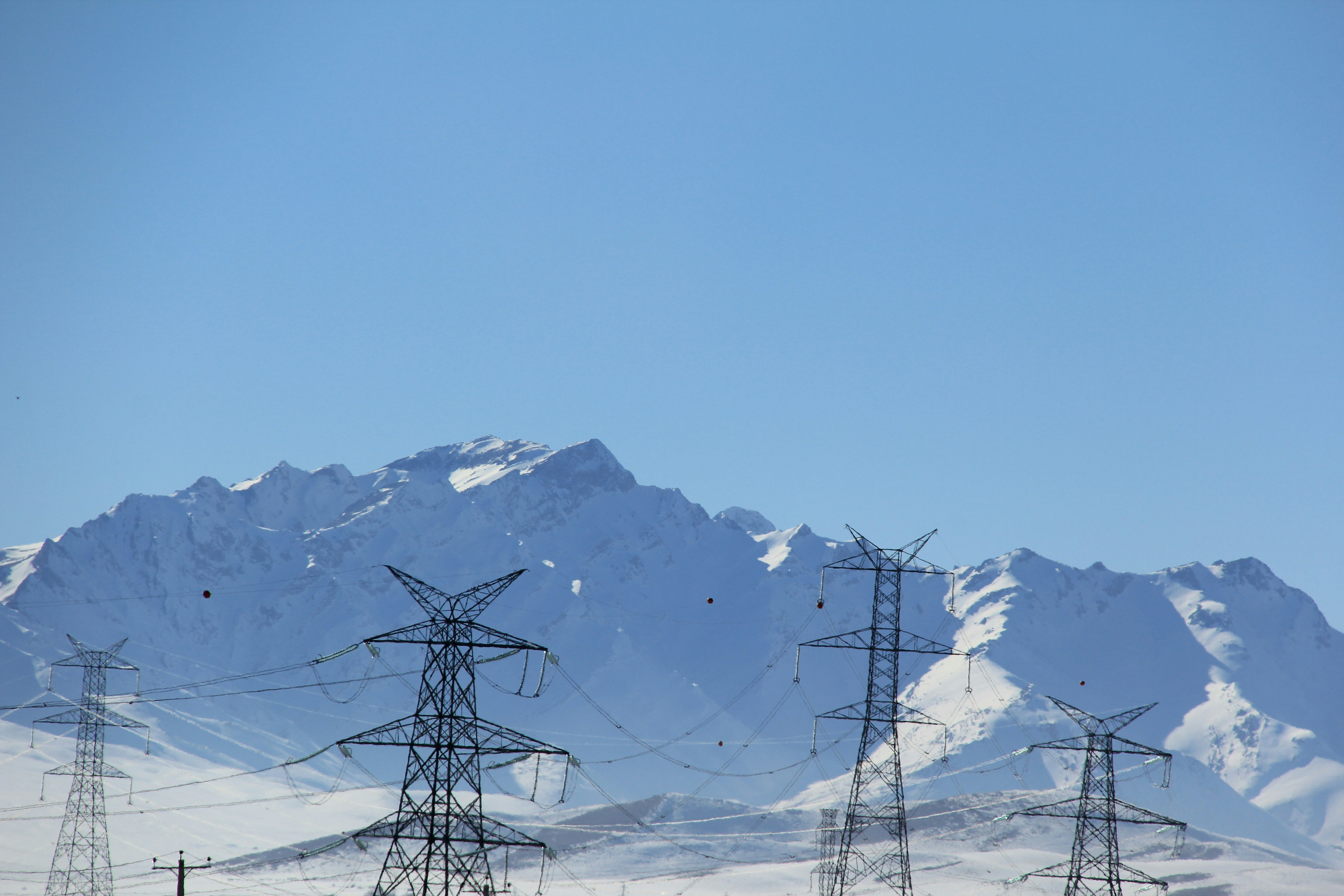 A group of power lines on a snowy mountain photo – Free Iran Image on ...