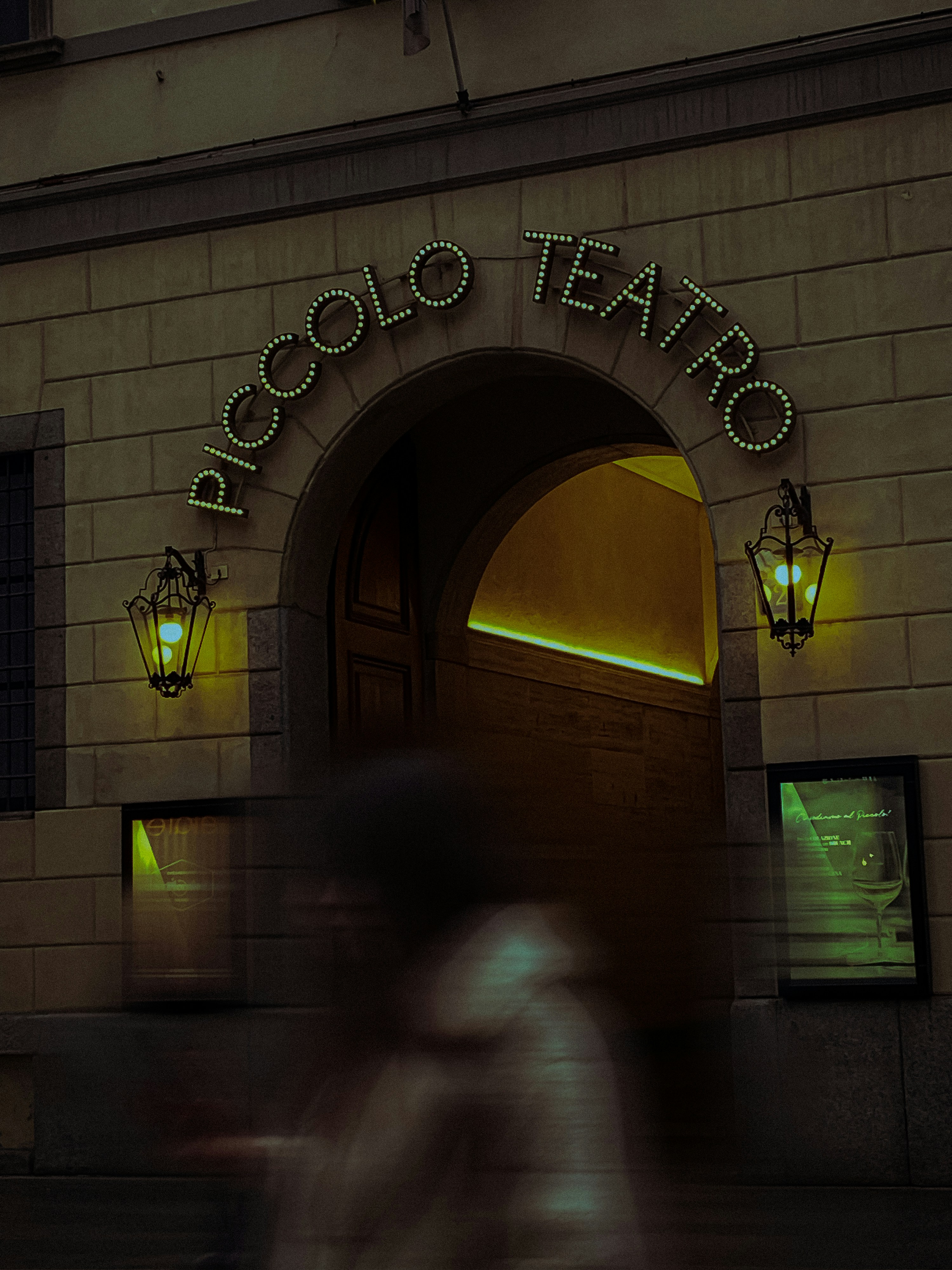 A person walking into a building photo – Free Piccolo teatro milano ...