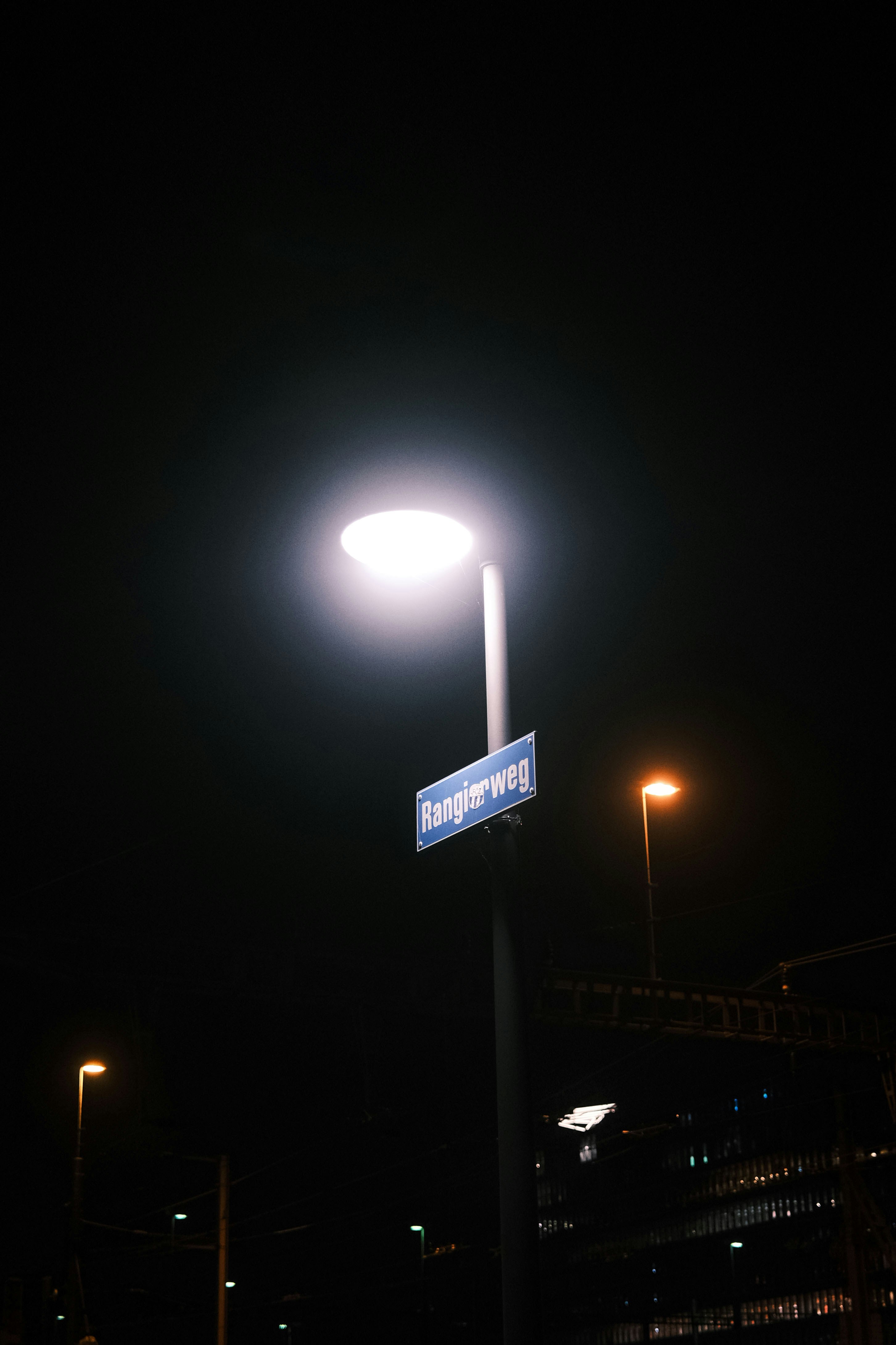 A street sign at night photo – Free Switzerland Image on Unsplash