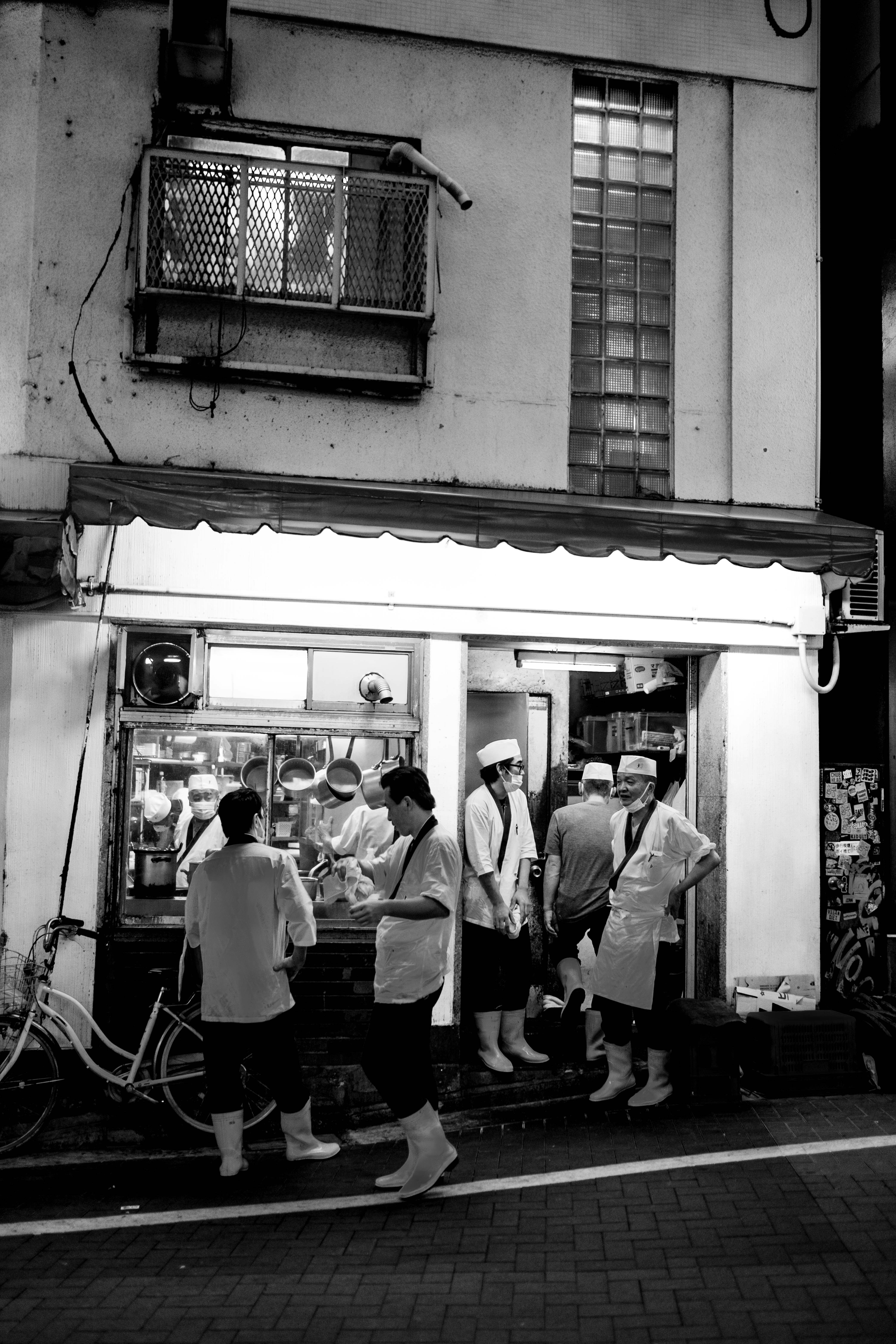 Cooks taking a smoke break at a yakitori restaurant