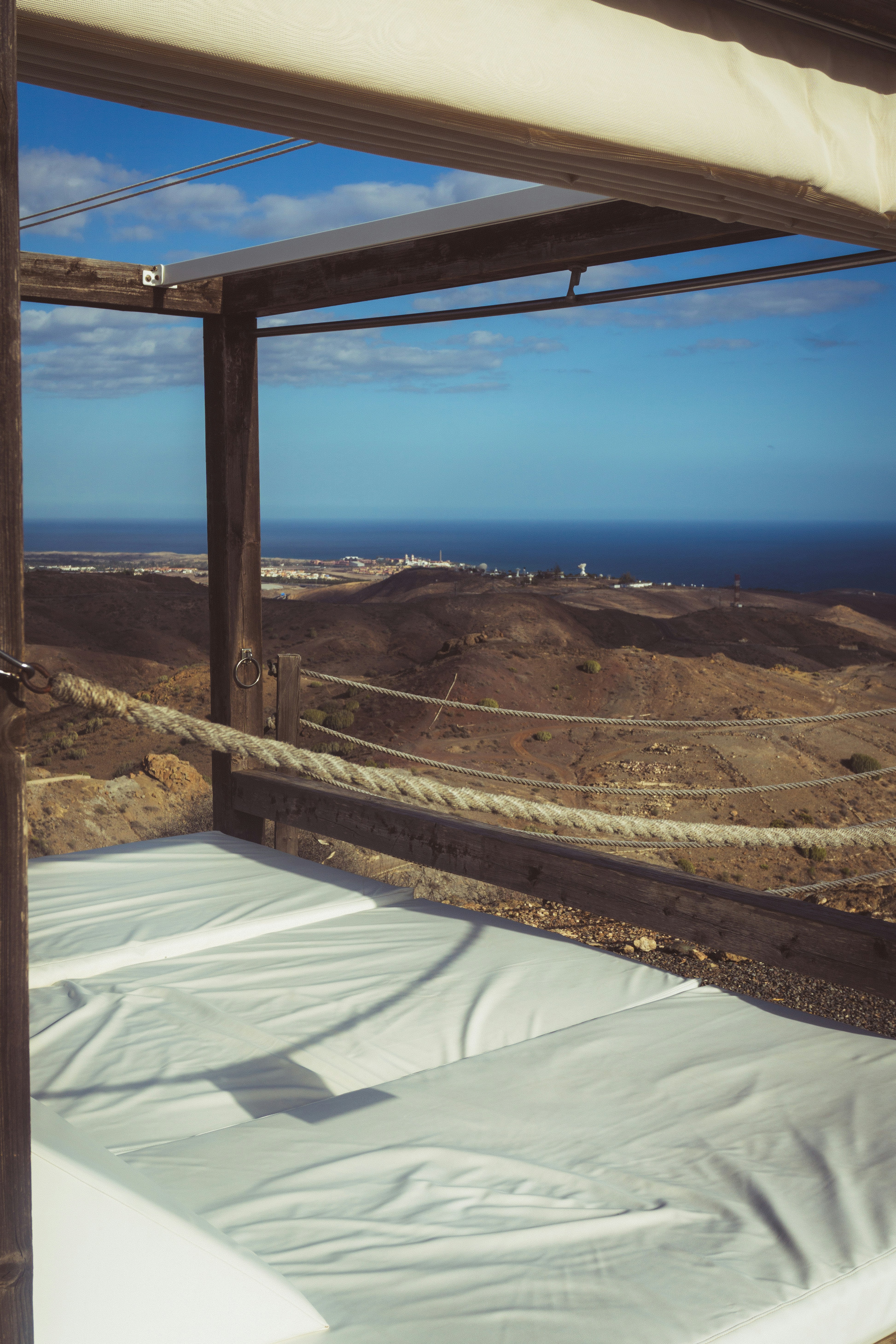 Under a Canopy: Aegean Vista from a Shaded Terrace