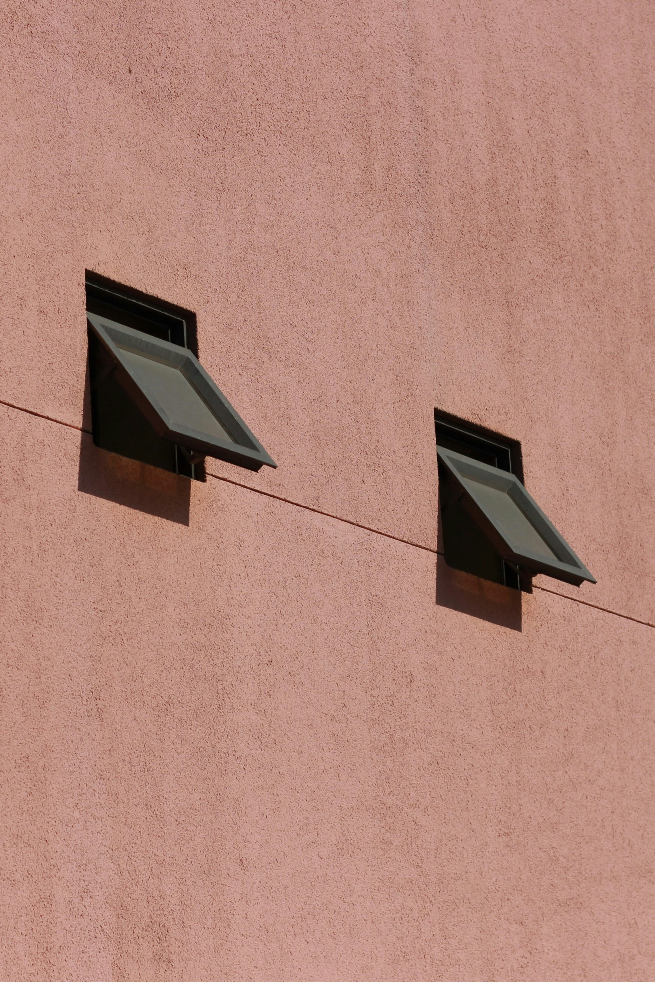 two windows on a wall