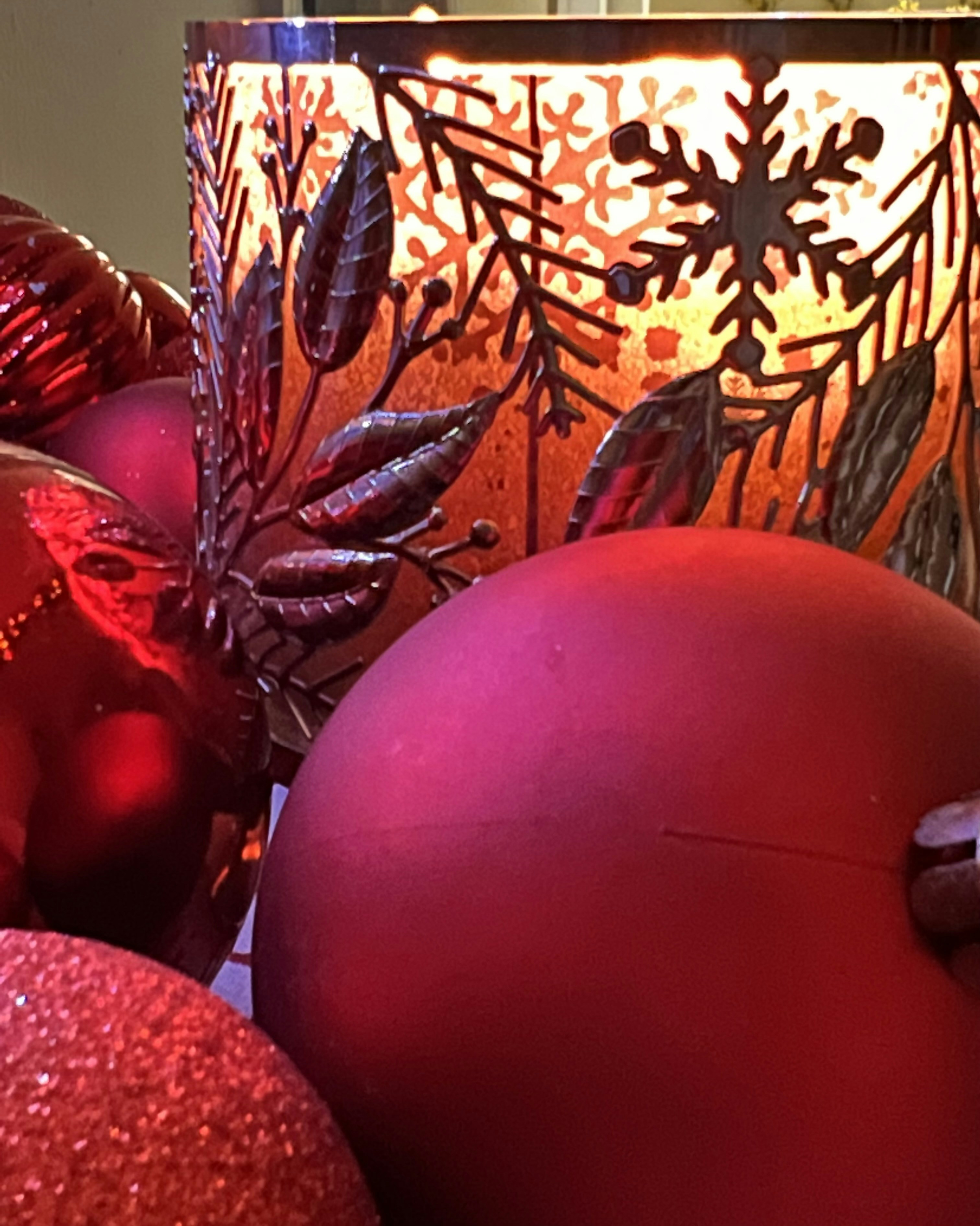 Candlelit Christmas Orbs: A Festive Close-Up