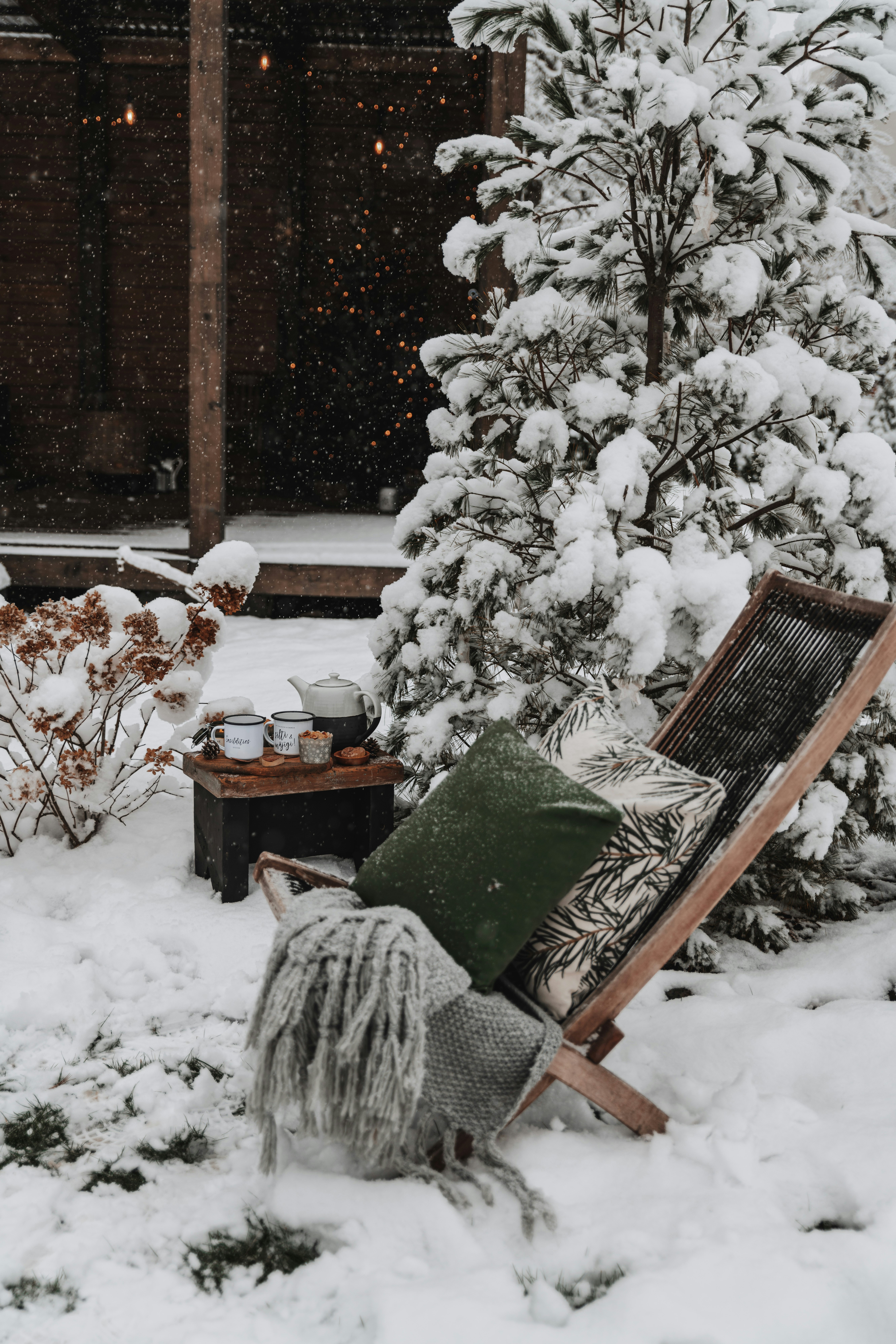 Snow-Kissed Oasis: Cozy Outdoor Corner Under a Winter Sky