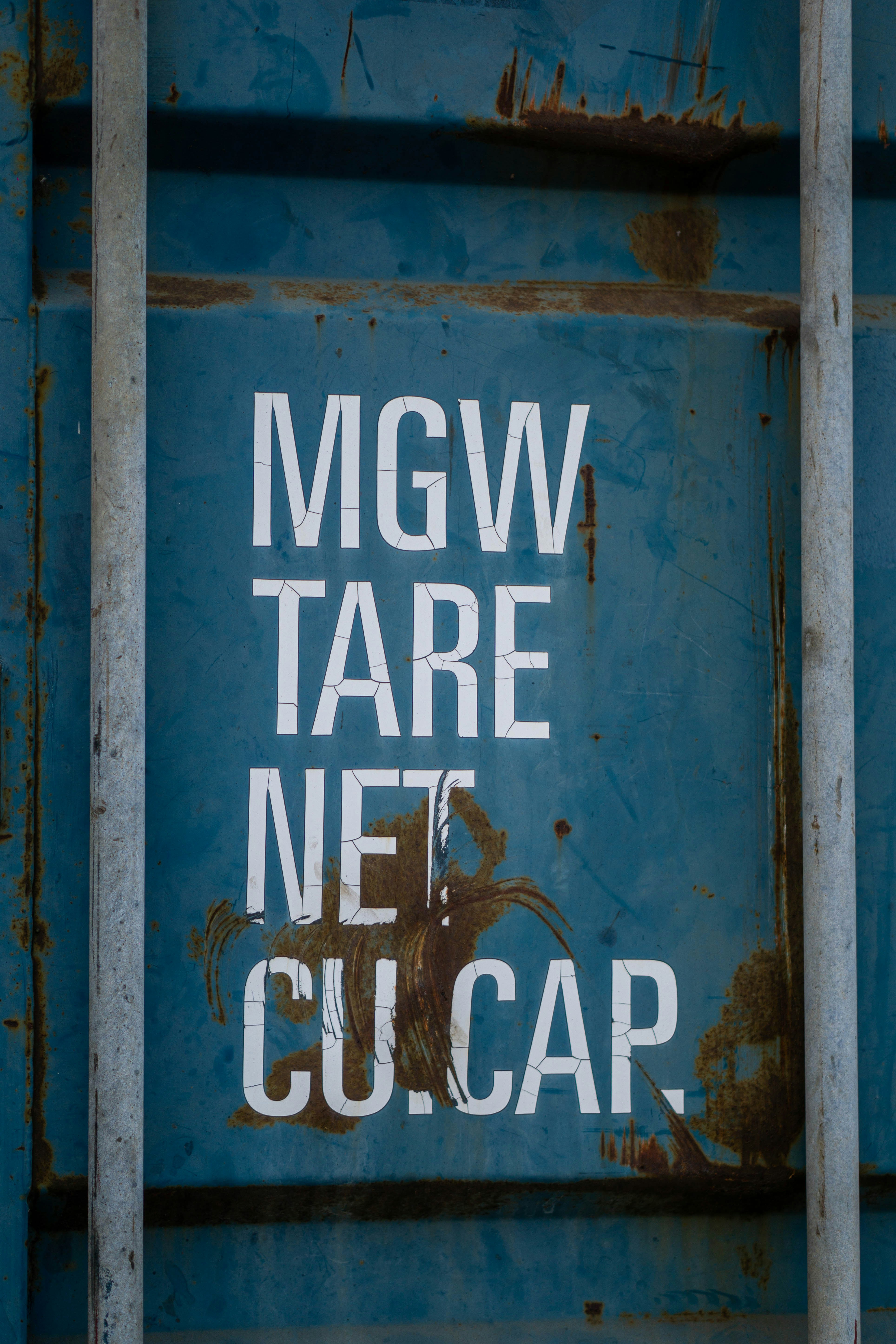 Azure Ledger: Weathered Letters Behind Steel Rails