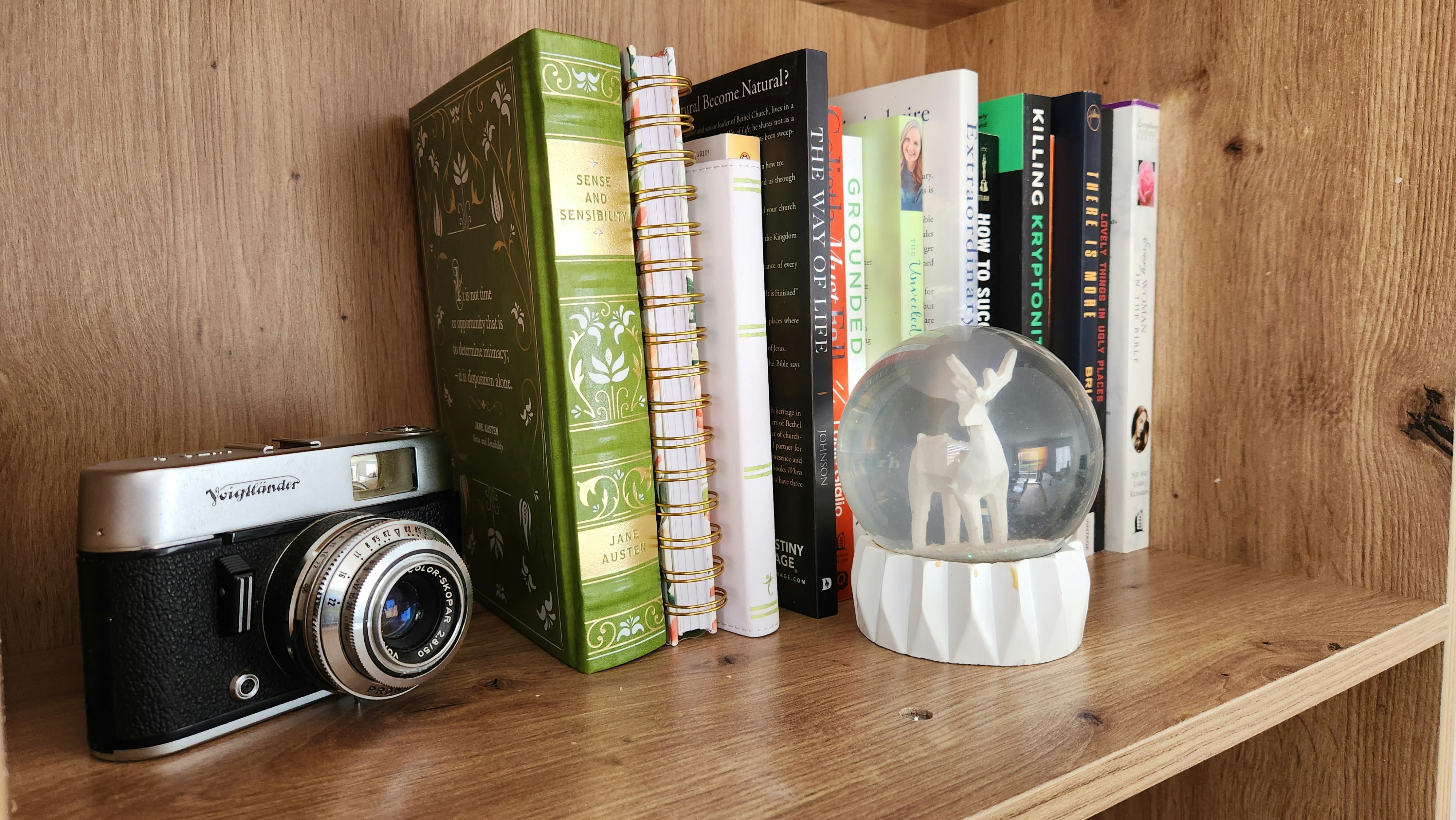 A camera next to a stack of books photo – Free Camera Image on Unsplash