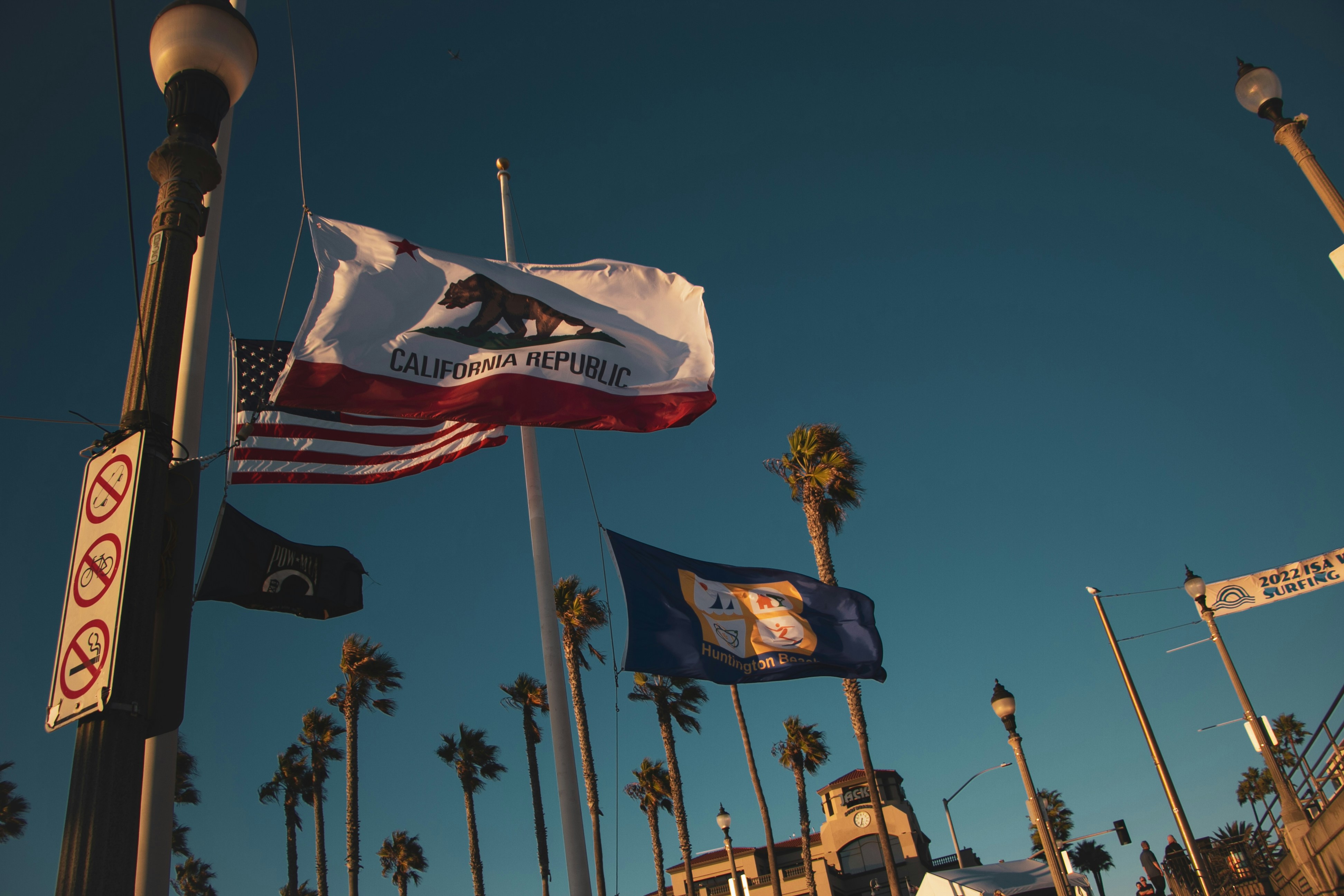Flags flying in the air photo – Free Huntington beach Image on Unsplash