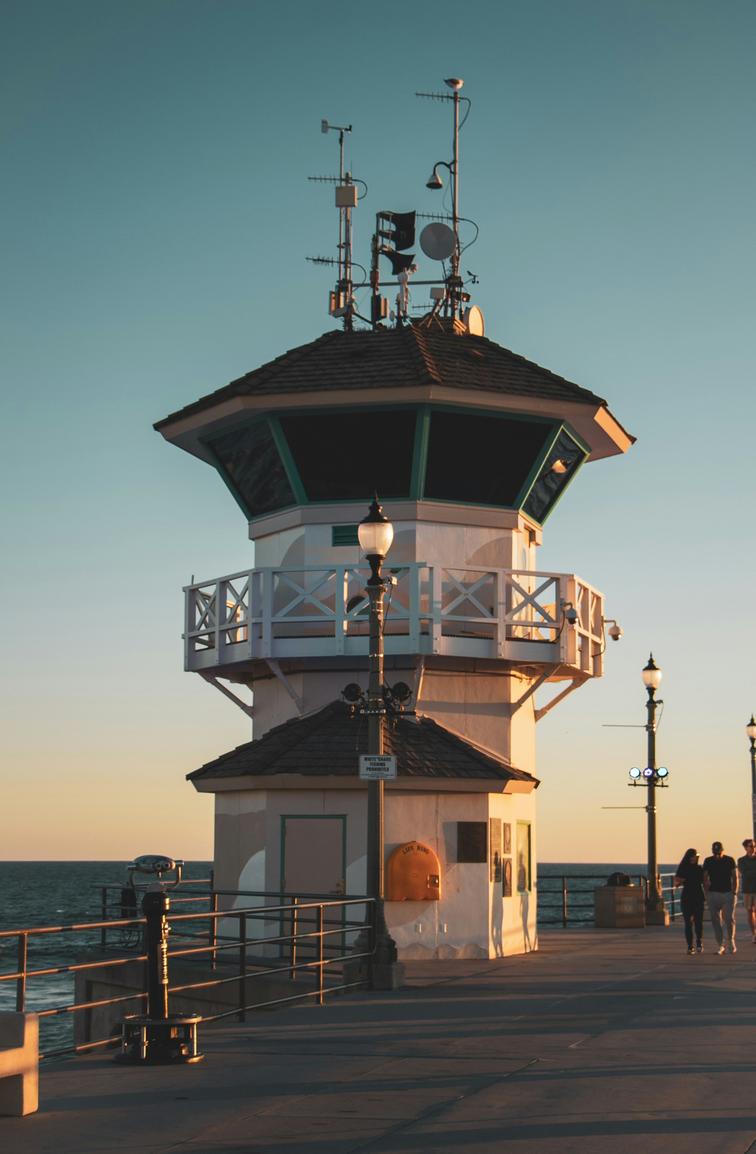 Sunset Watchtower Over a Quiet Pier