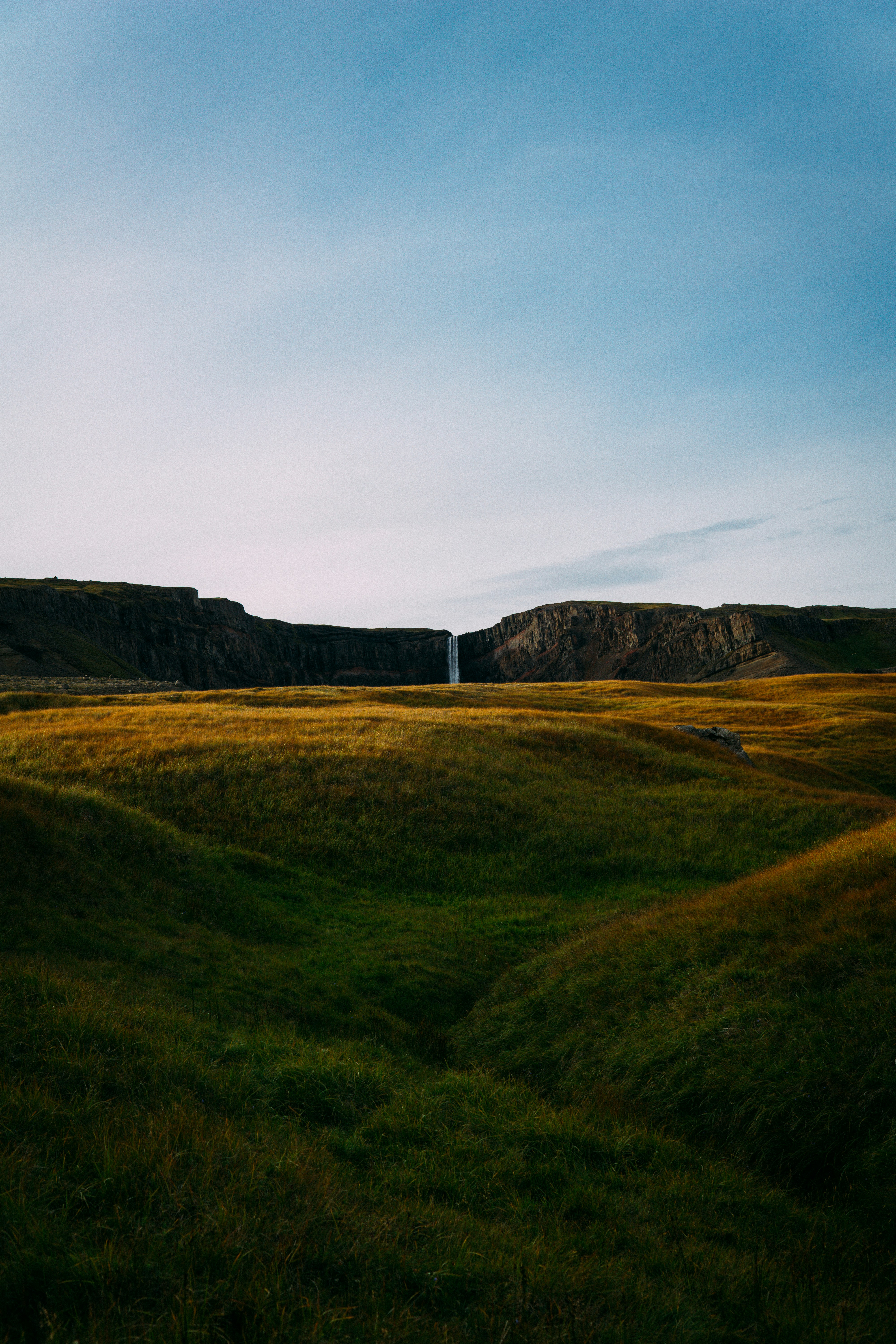 Crest of Light: Sunset Grasslands and Cliff Ring