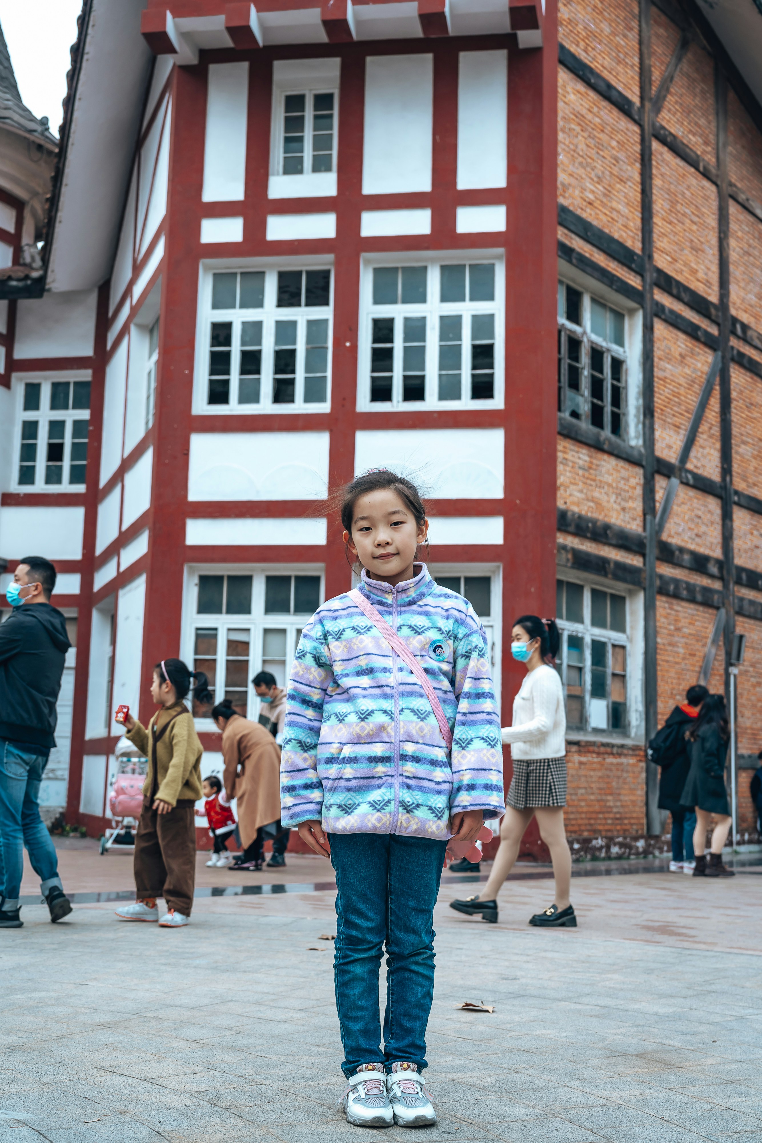Centered in Bloom: A Quiet Portrait Amid a Festive Courtyard