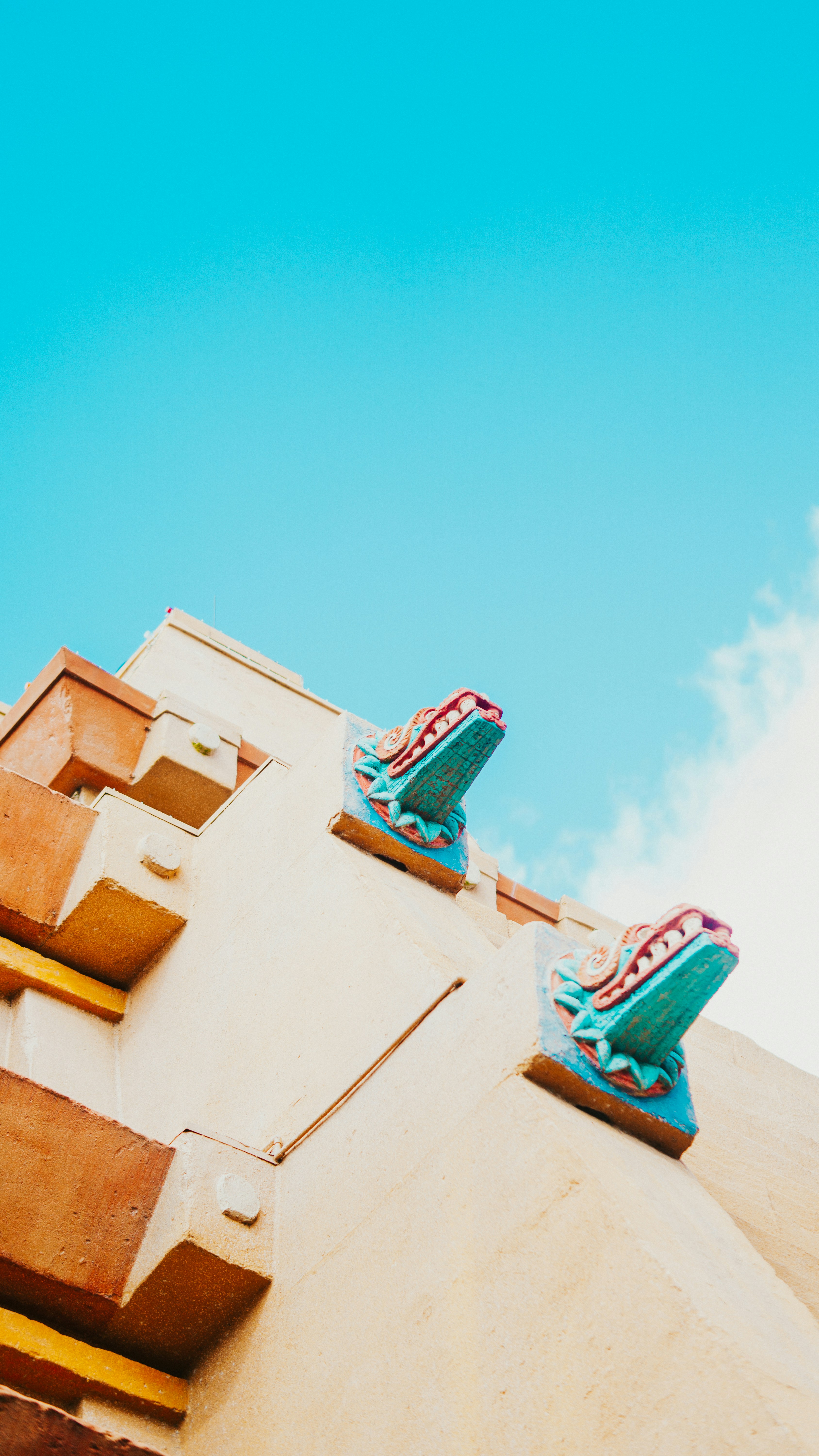 Turquoise Dragon Brackets Guard a Sunlit Terrace