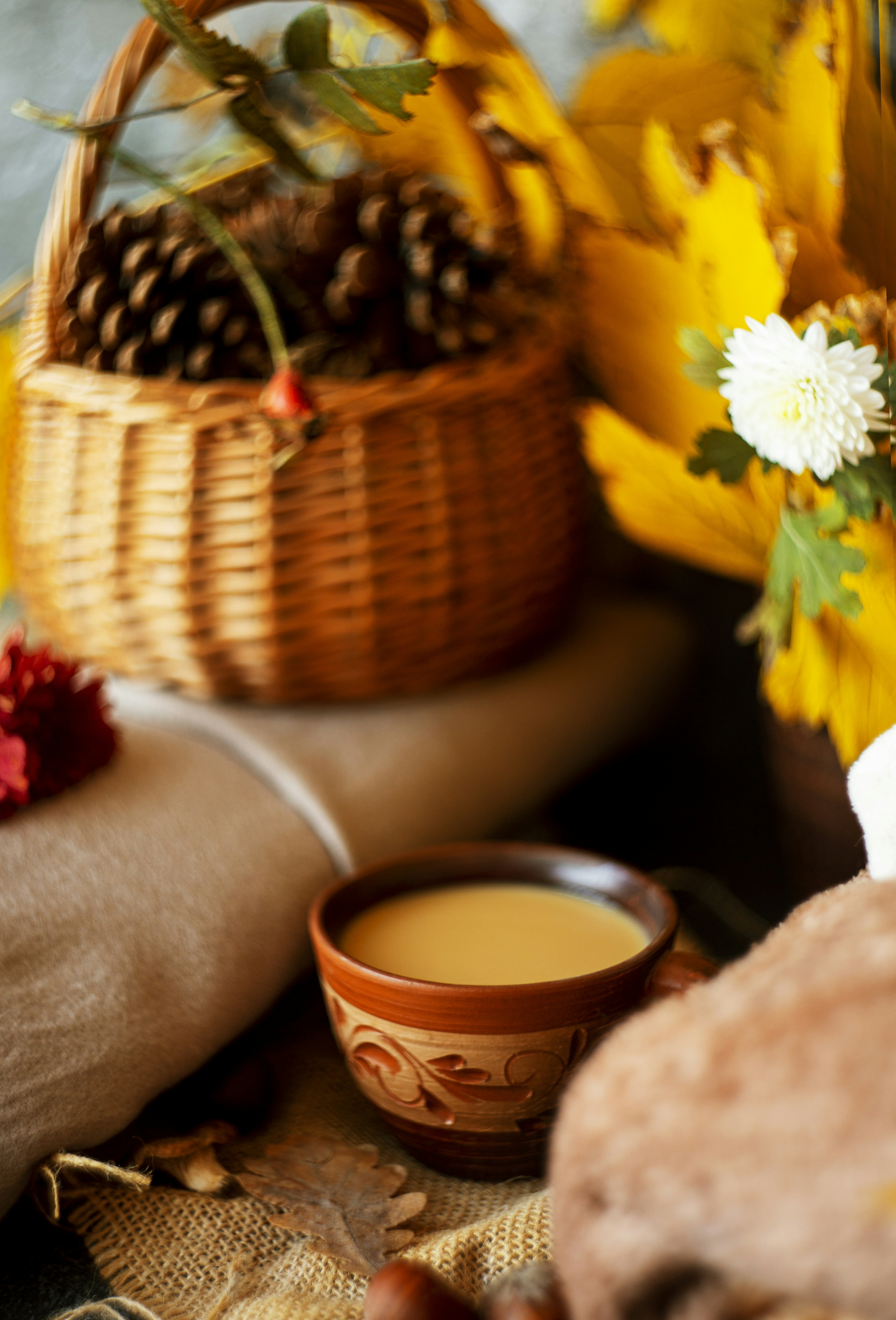 Teacup in Autumn's Glow: Harvest Basket and Chrysanthemums