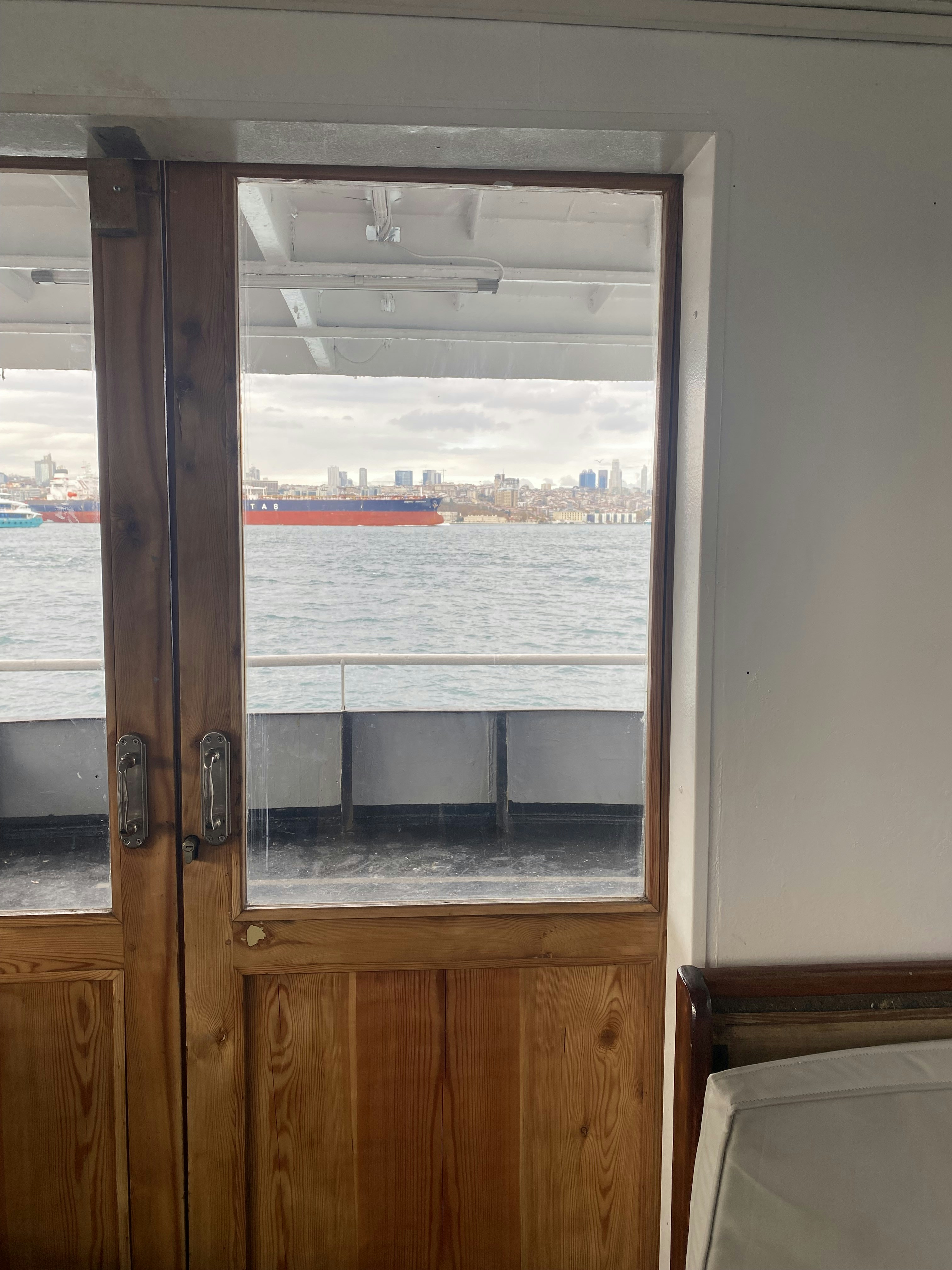 a door with a view of a city and water