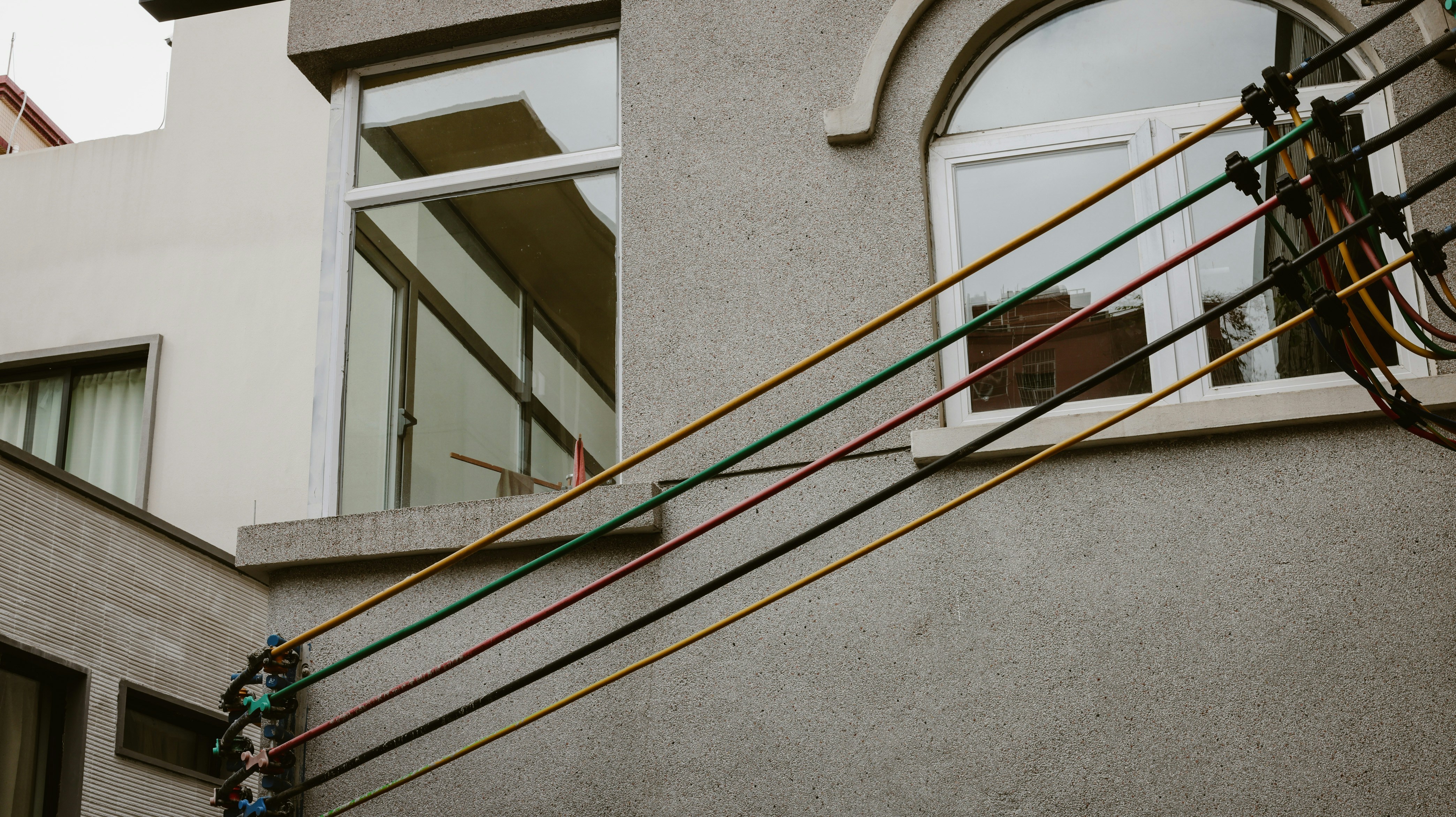 A building with a green railing photo – Free Handrail Image on Unsplash