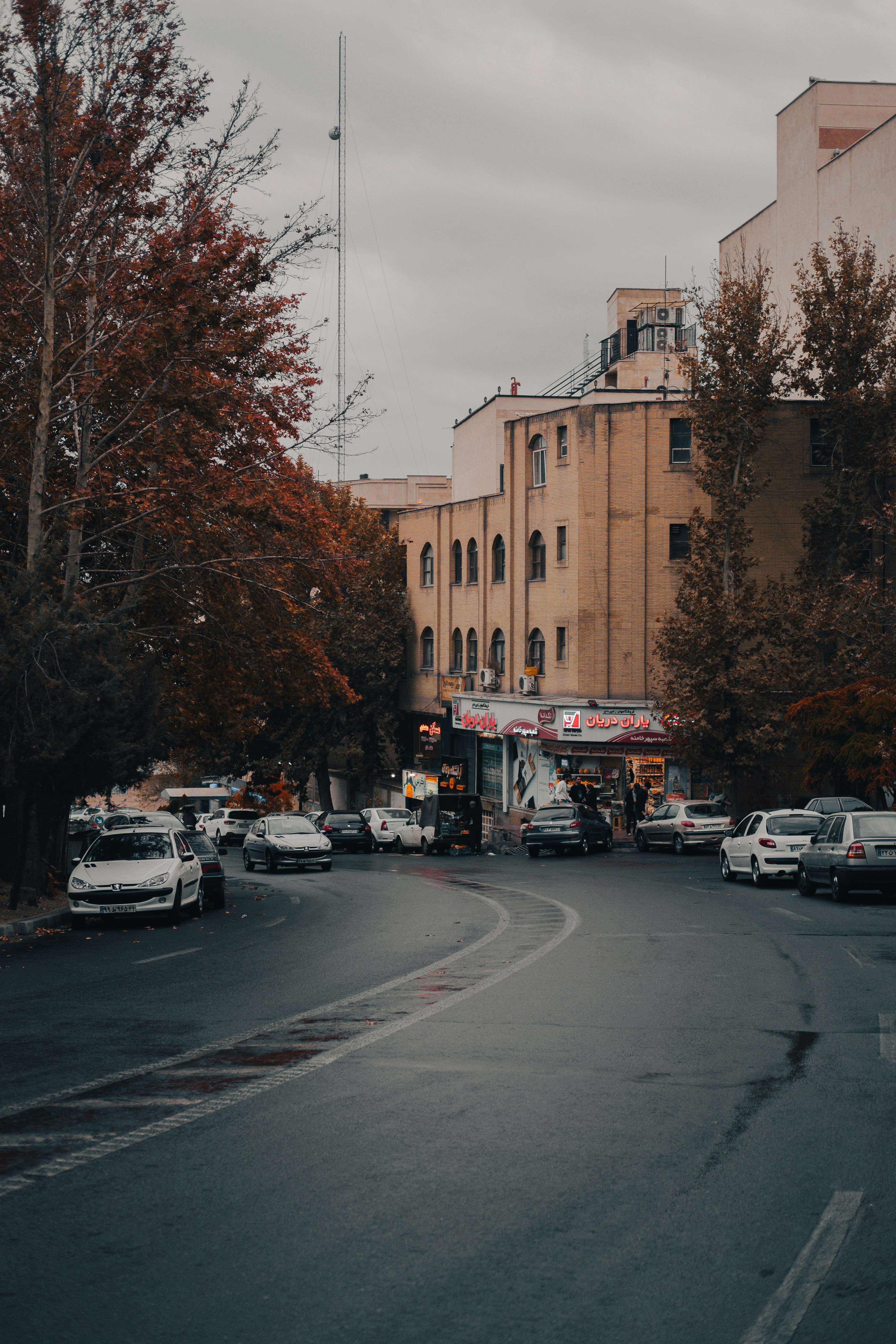 A street with cars and buildings on the side photo – Free Tehran Image ...