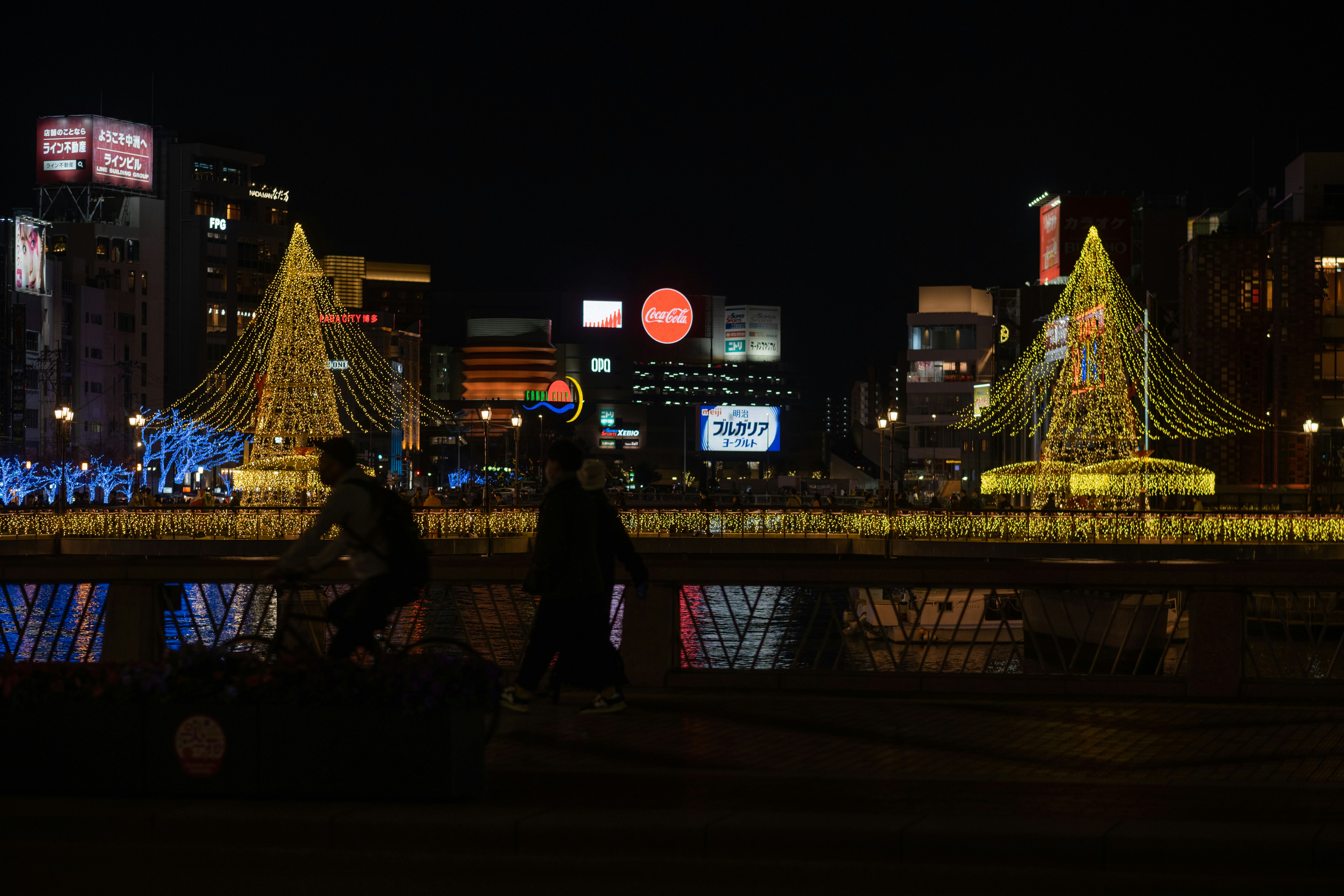 Neon Twin Trees Over the Riverfront: A Quiet Night in City Light