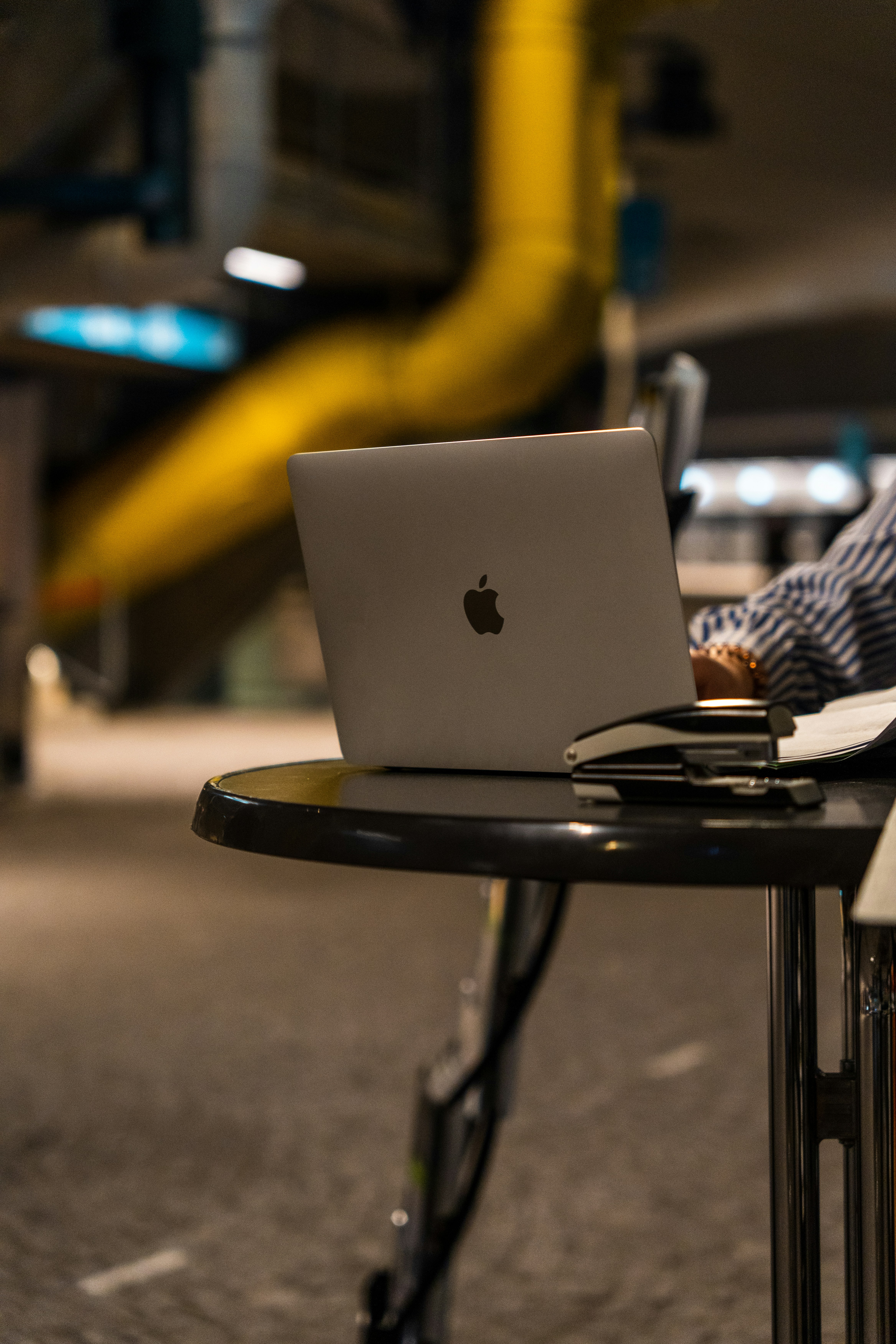 Quiet Power: A Laptop on a Streetside Table in an Ambient Night