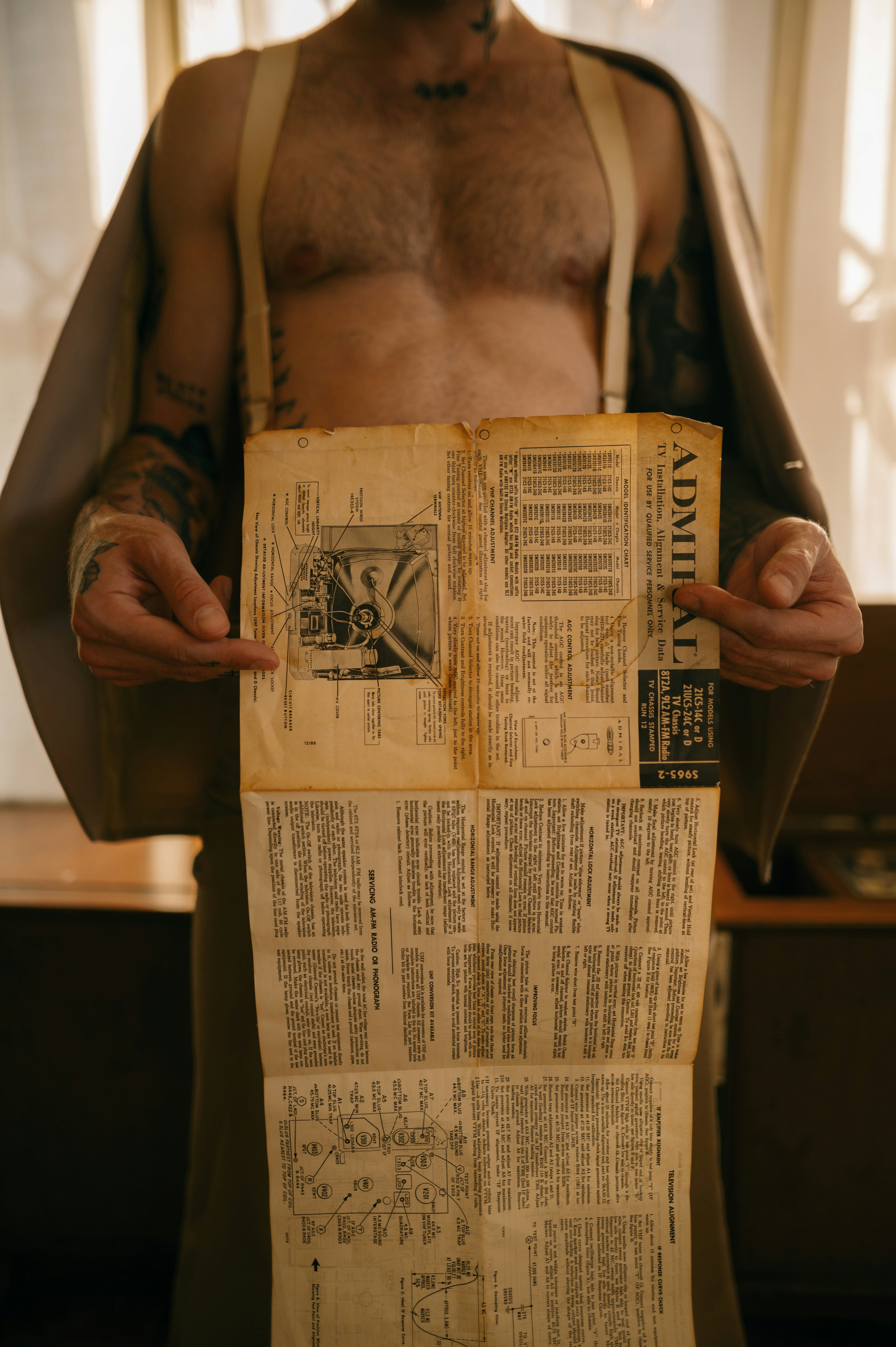 A person holding a newspaper photo – Free Skin Image on Unsplash