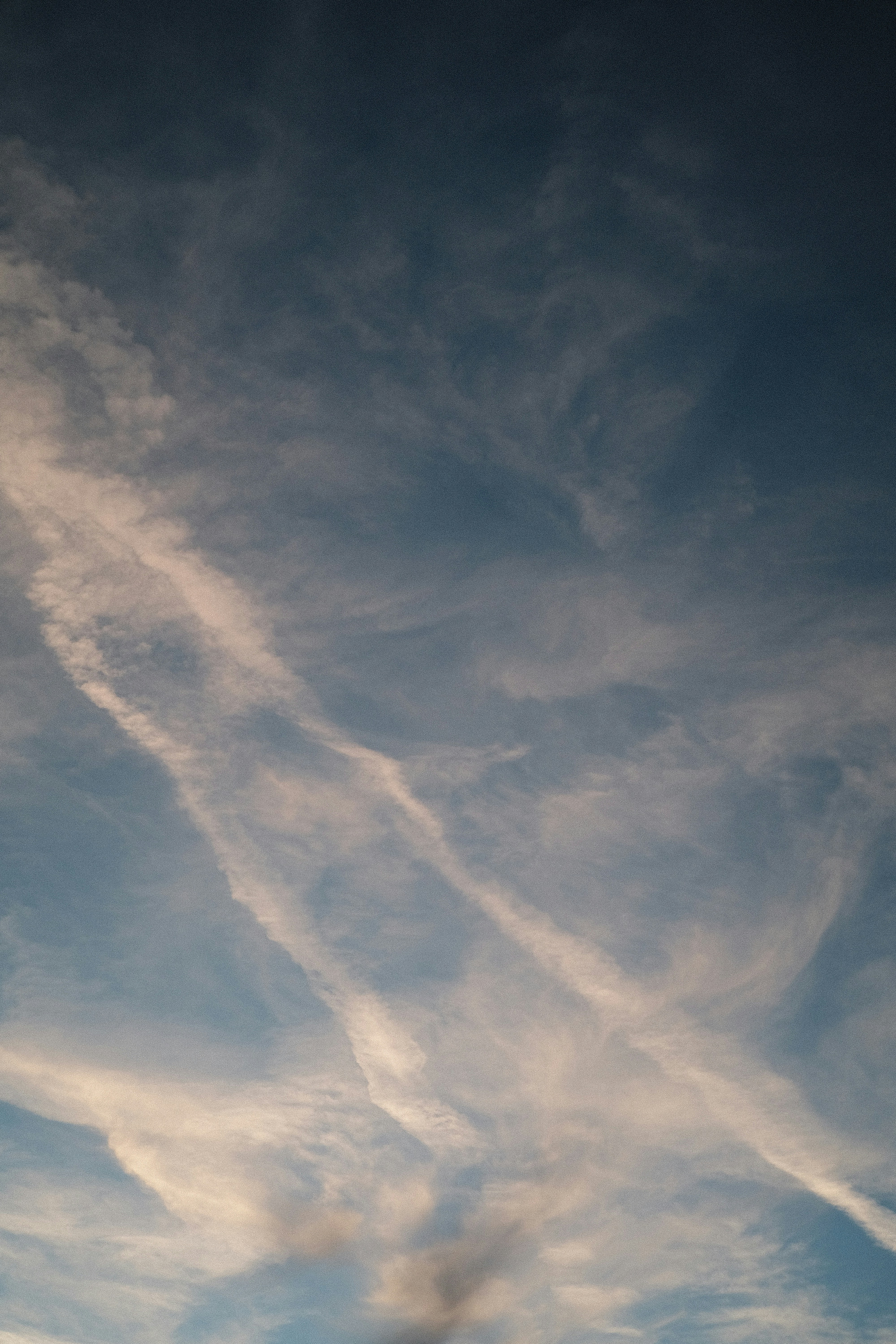 Contrails Carved Across a Serene Sky