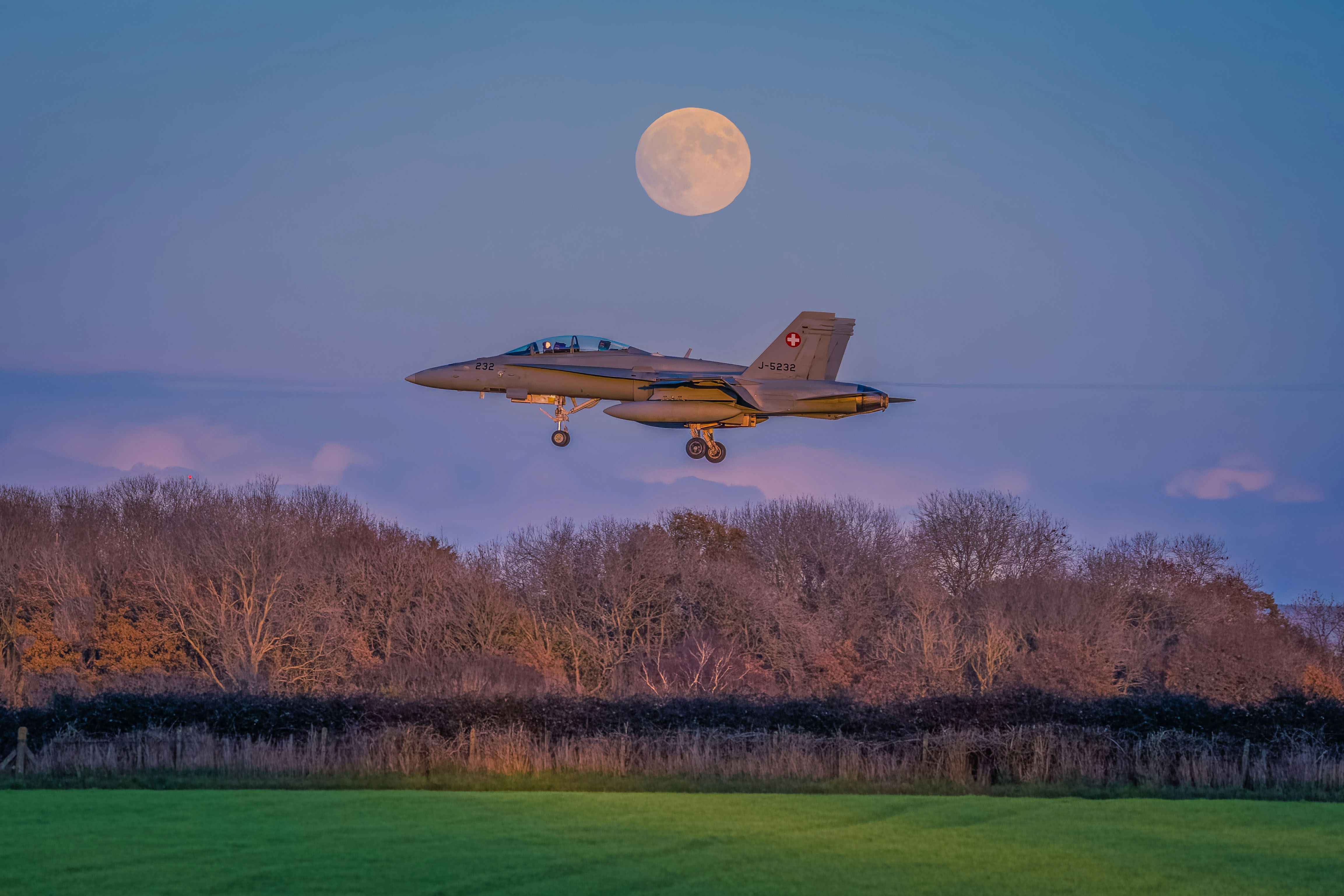 Moonlit Jet Over Autumn Horizon