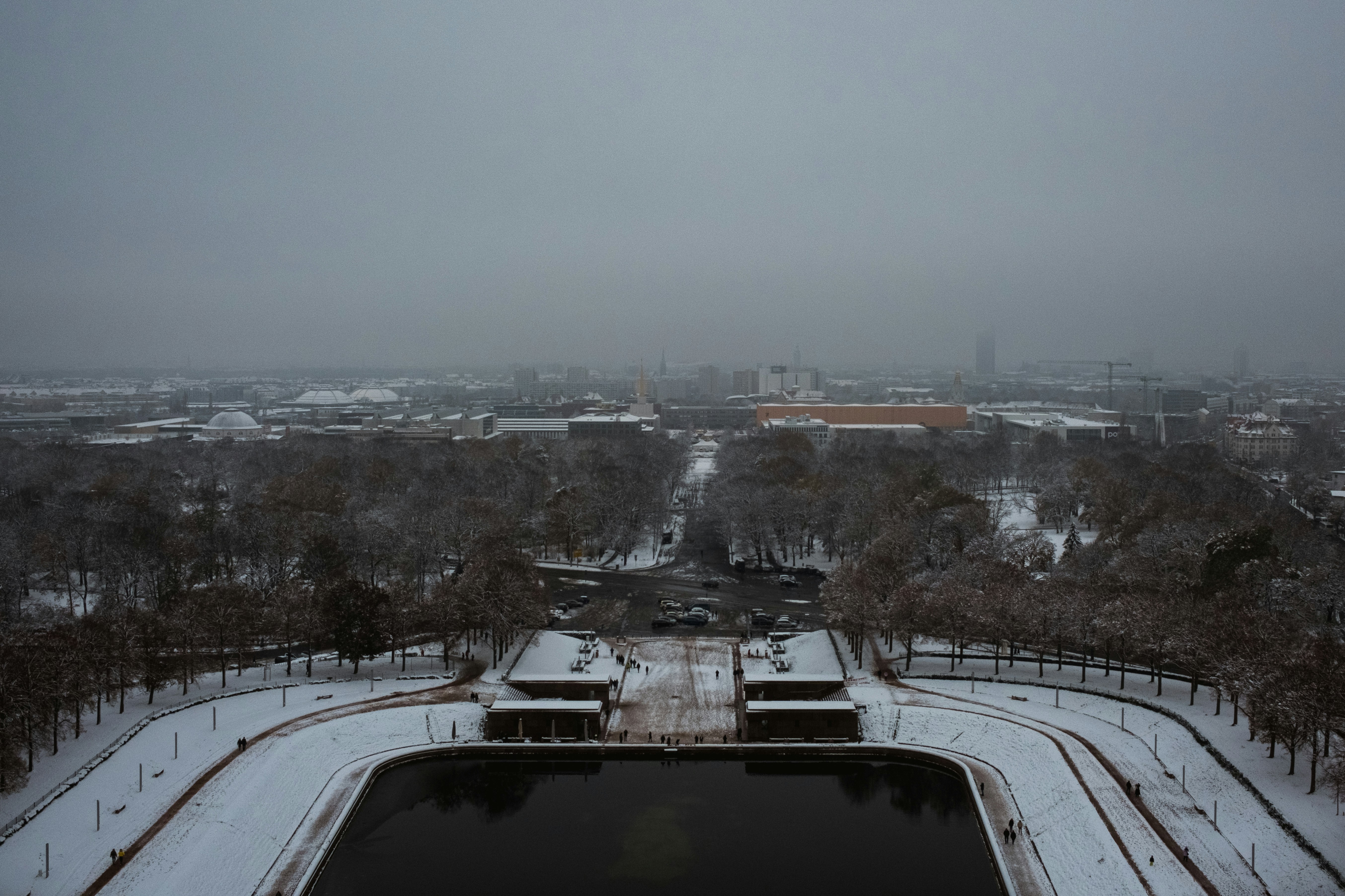A snowy landscape with buildings and trees photo – Free Winter ...